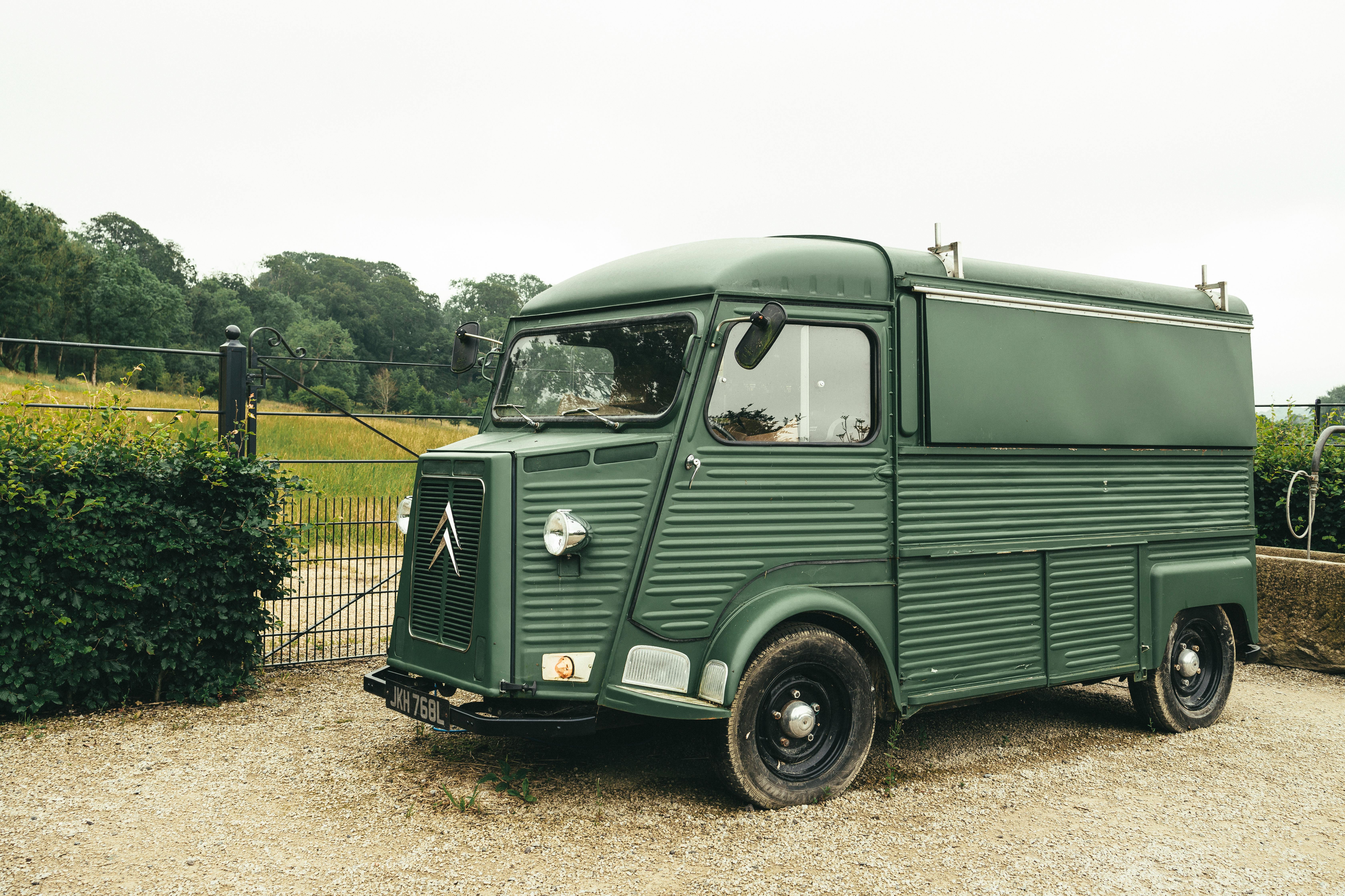Green Van on Brown Dirt Road · Free Stock Photo