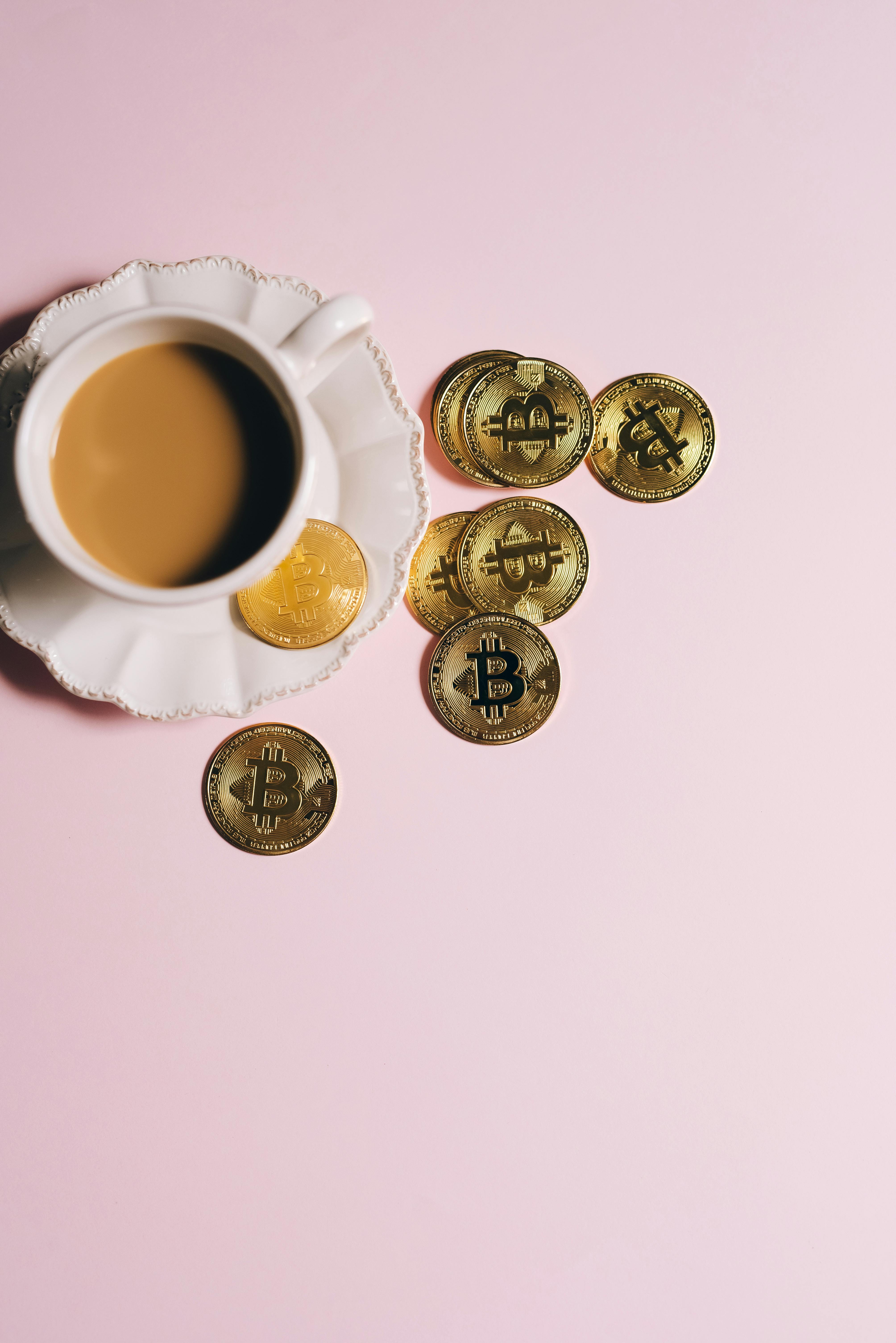 Gold Coins and a Cup of Coffee · Free Stock Photo