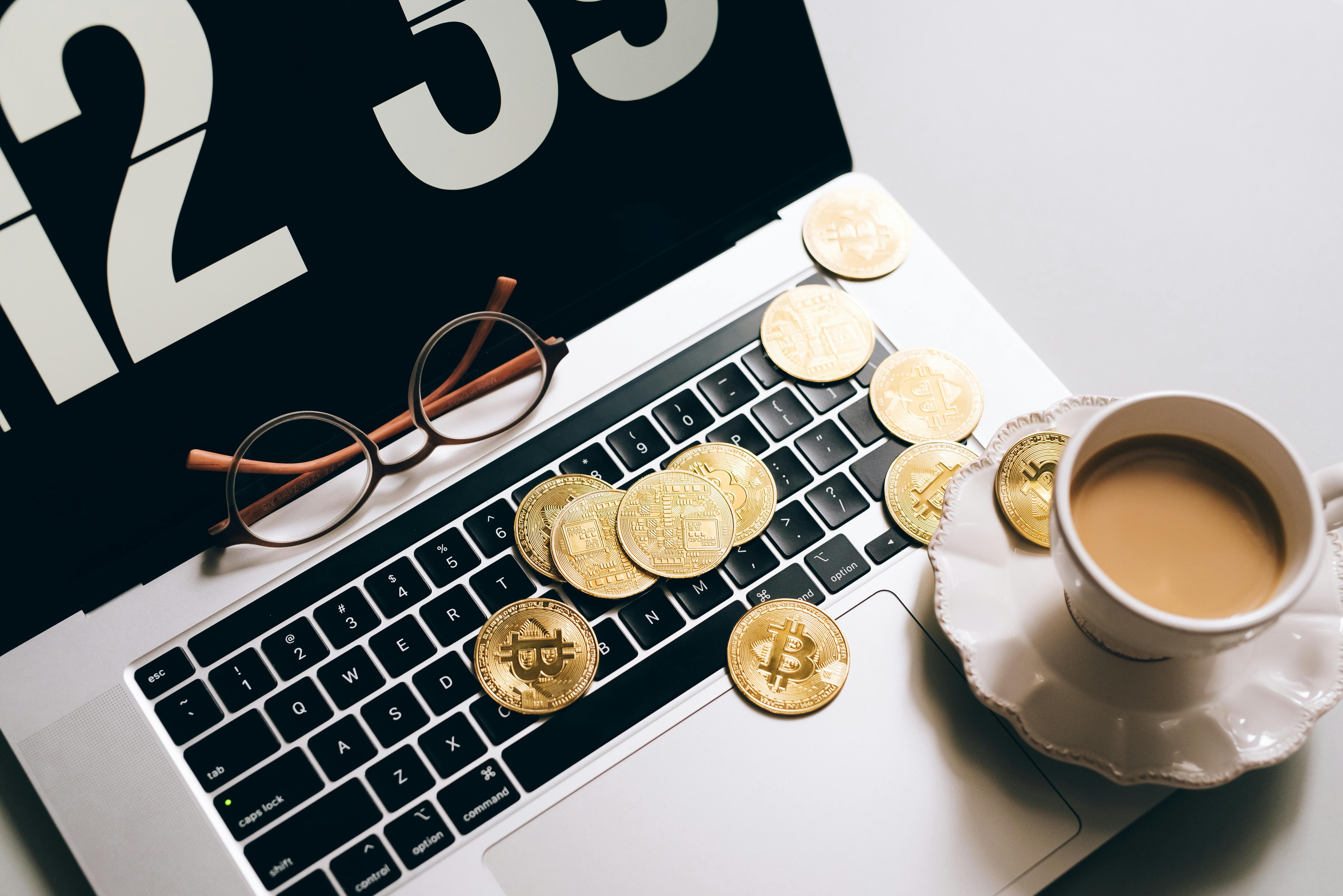 Gold Coins and a Cup of Coffee · Free Stock Photo