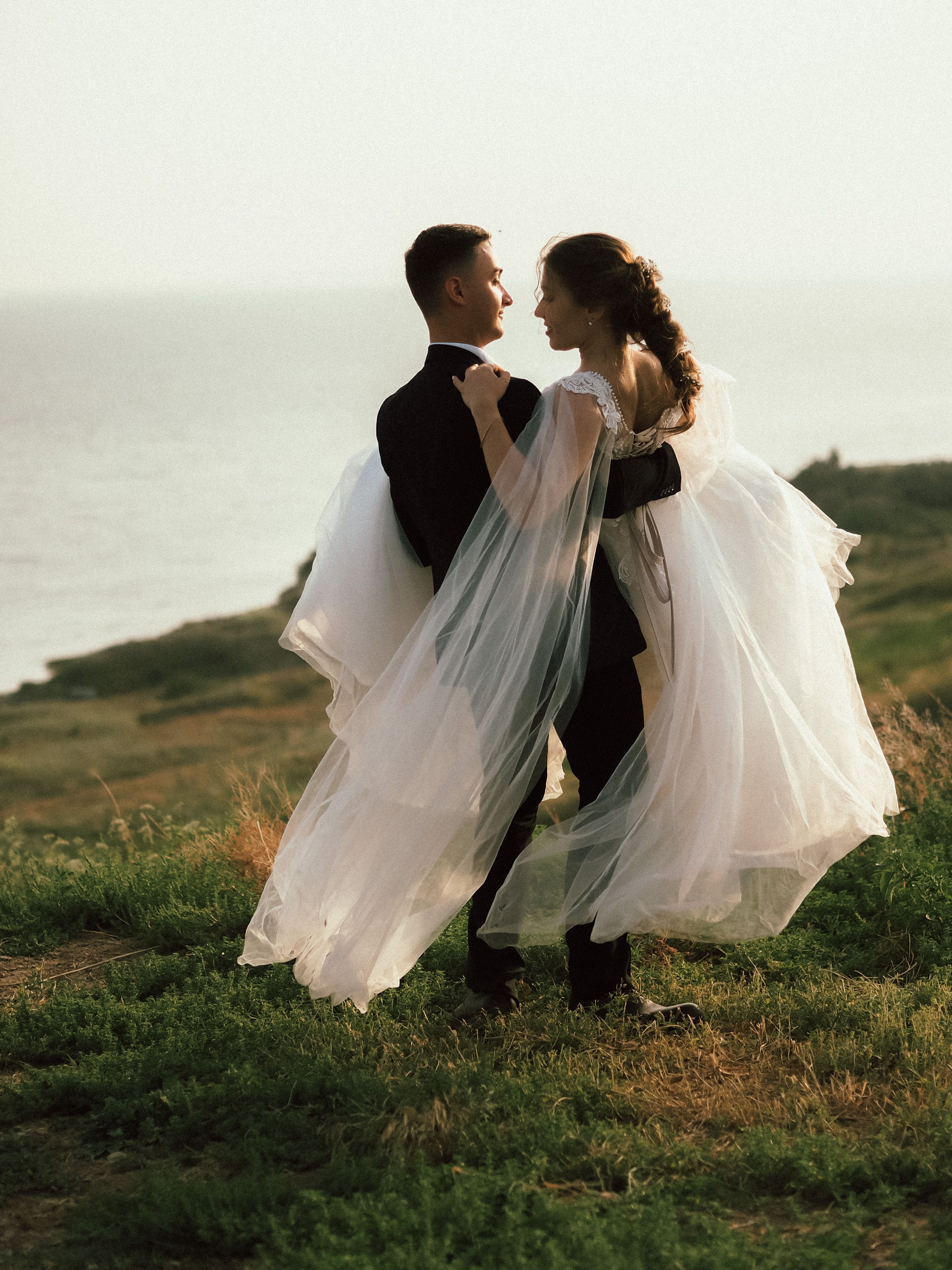 A Groom Carrying His Bride · Free Stock Photo
