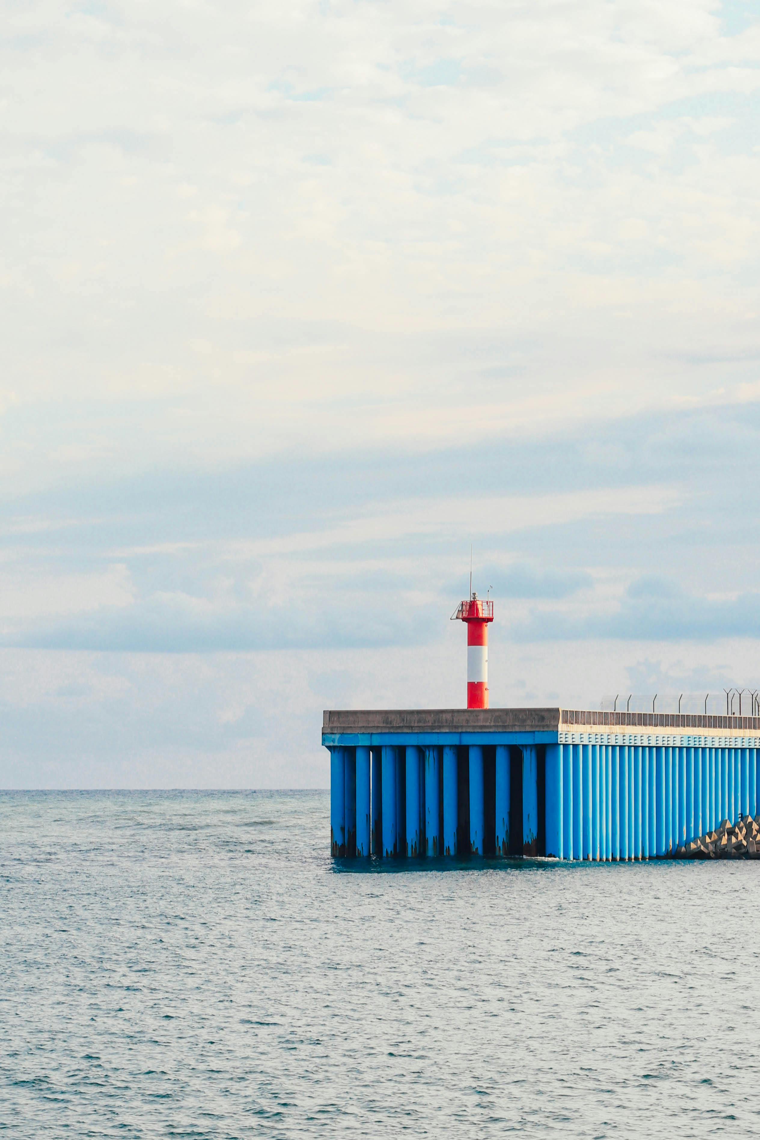 A Red Lighthouse on the Port · Free Stock Photo