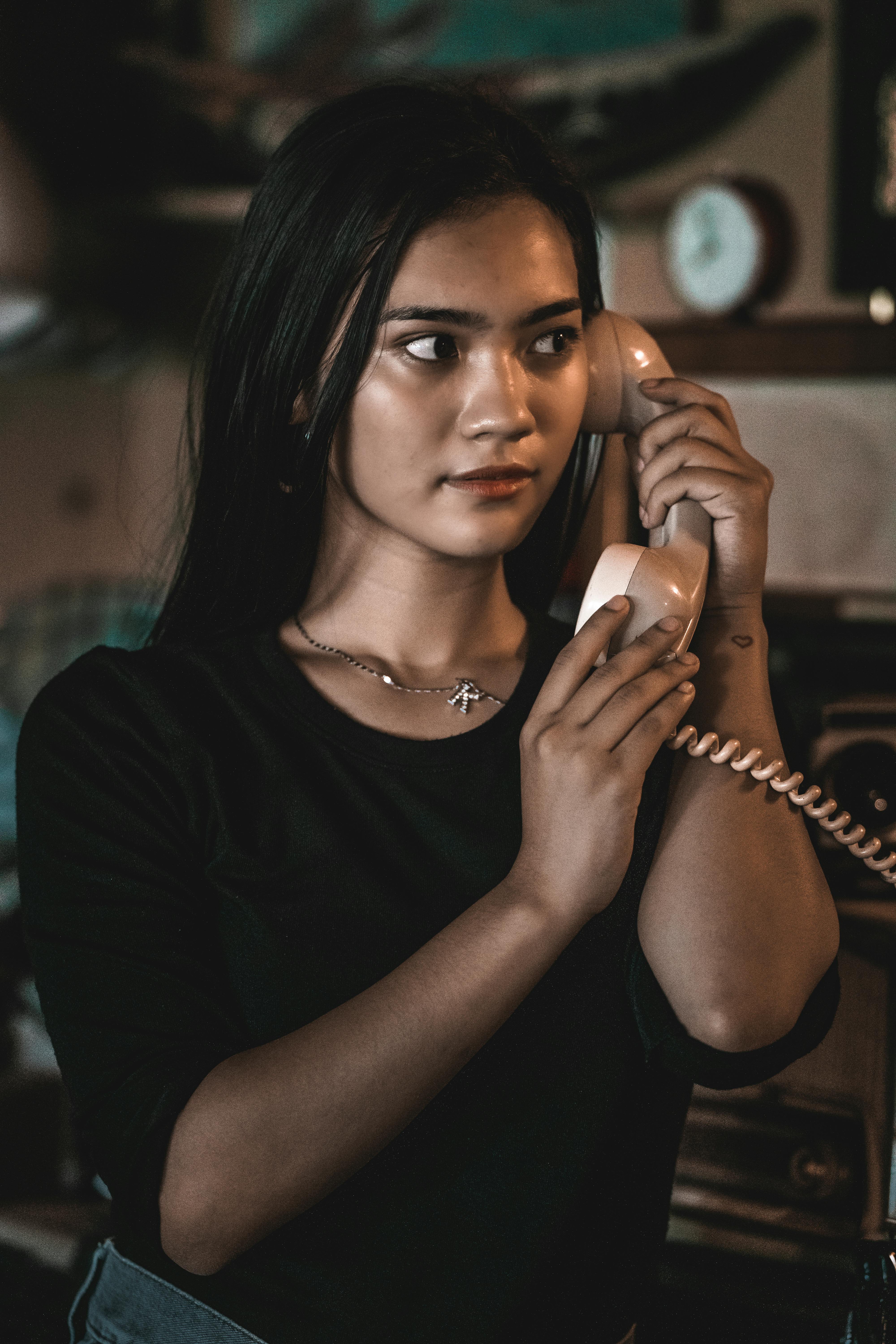 A Woman using Telephone · Free Stock Photo
