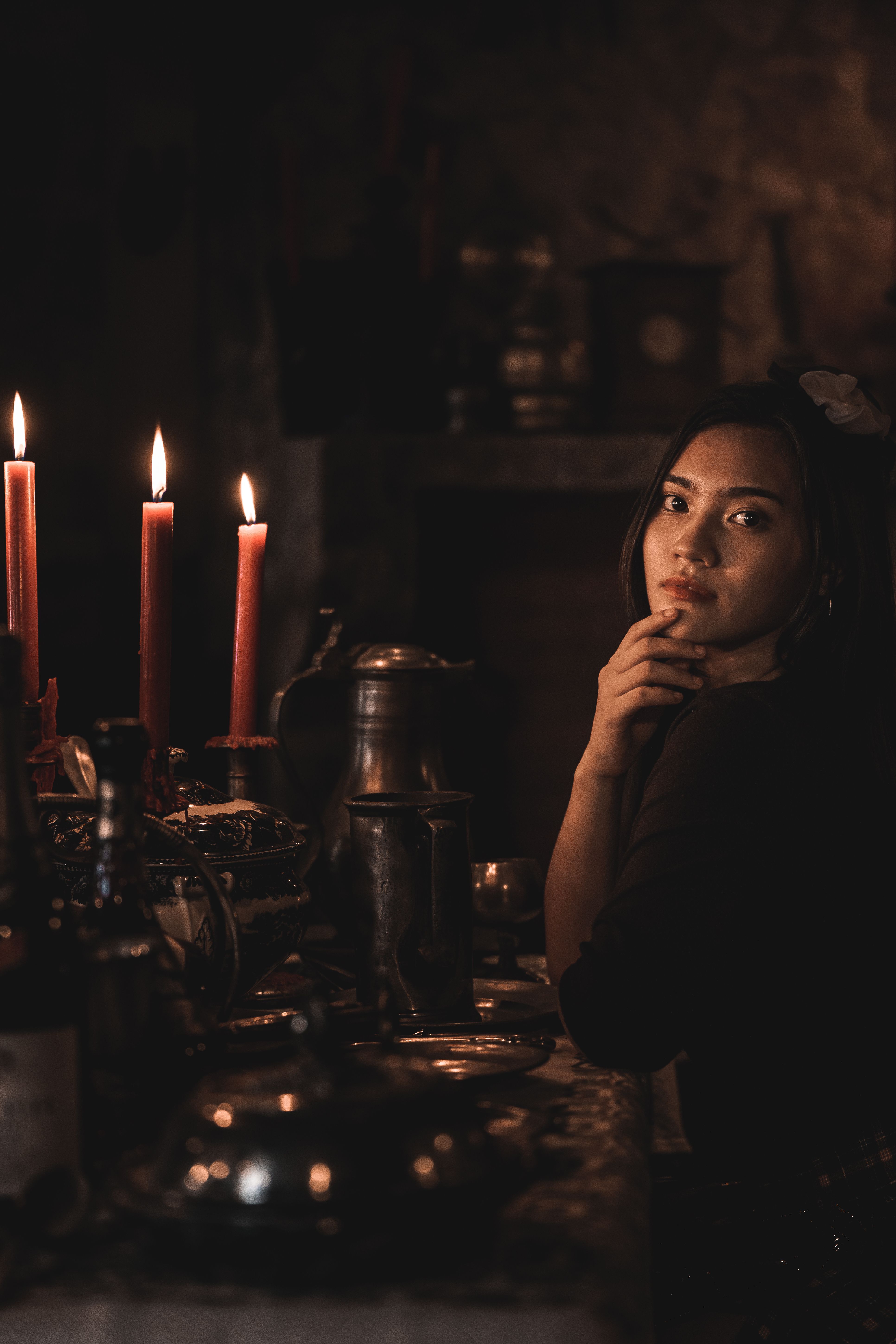 Man Holding Lighted Candle in Dark · Free Stock Photo