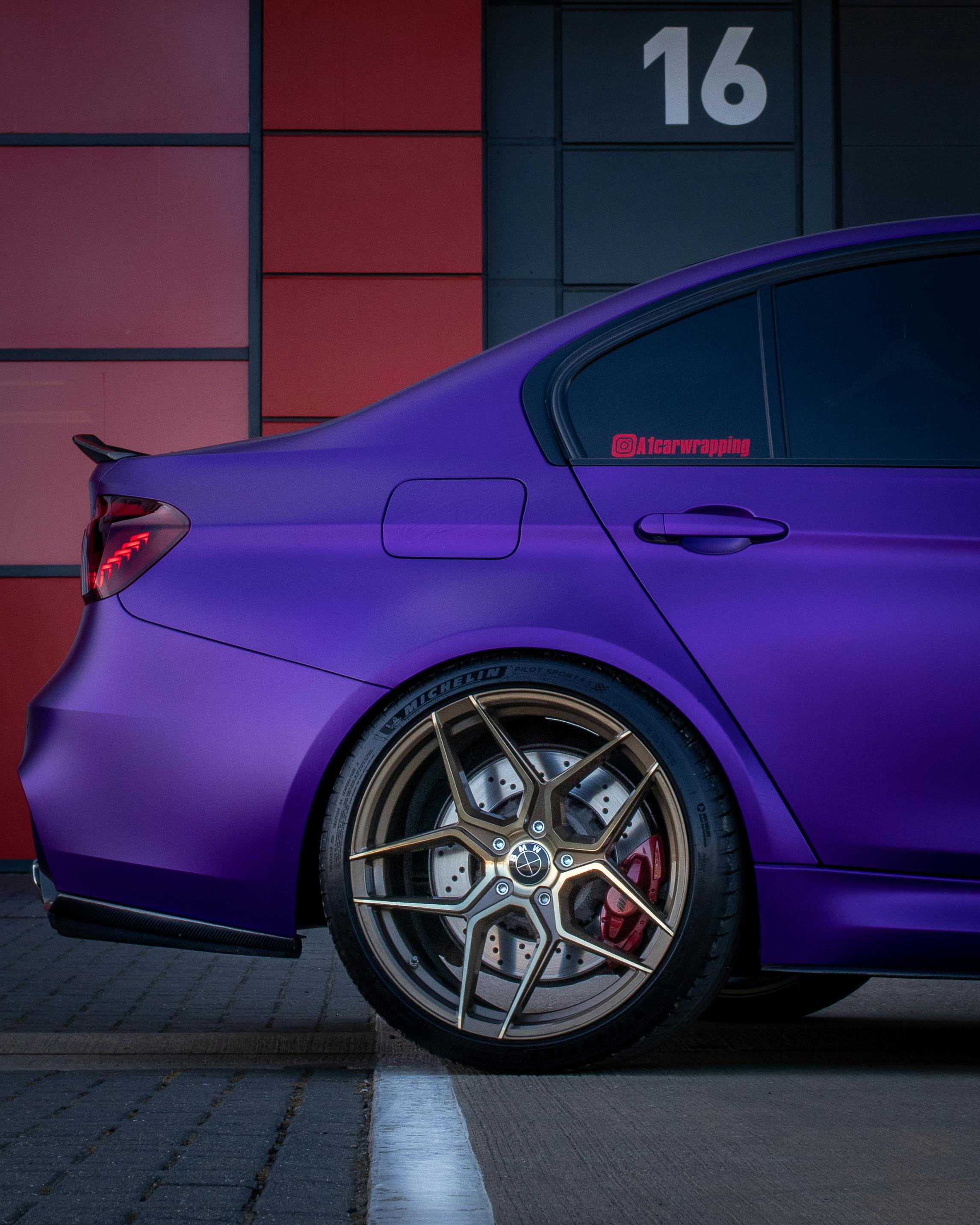 A Purple BMW with Bronze Mags · Free Stock Photo