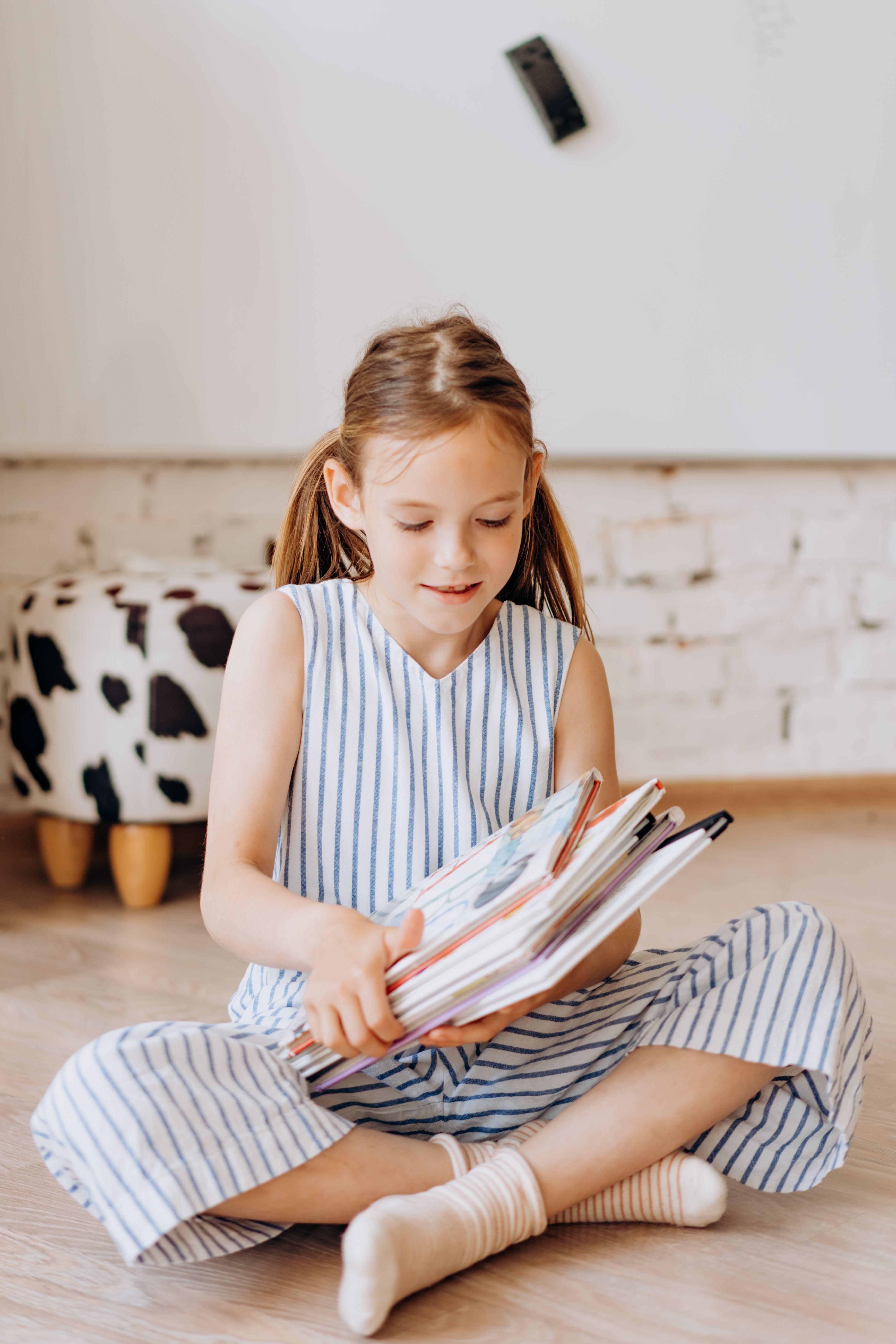 A Girl Holding Books · Free Stock Photo