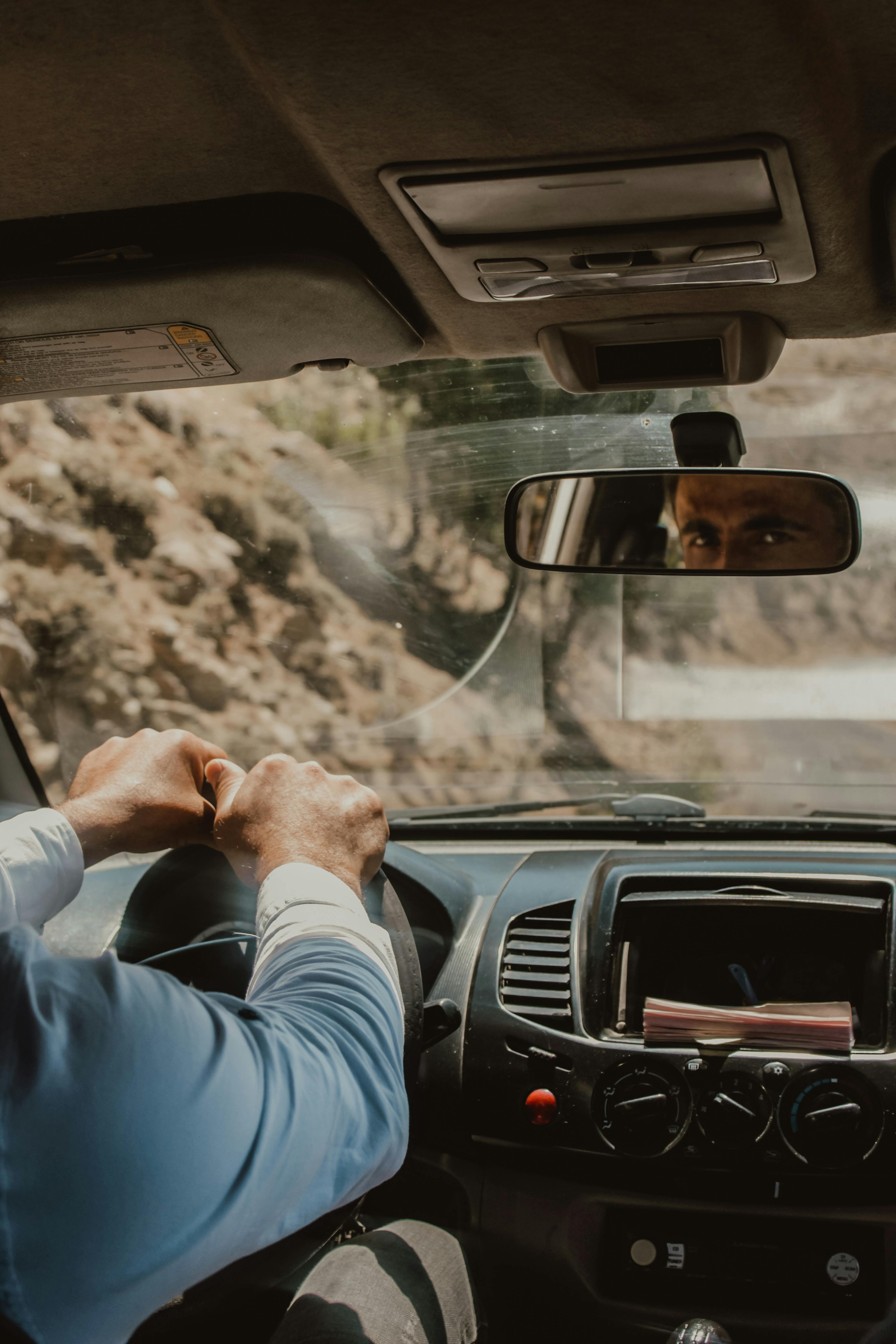 Person Inside Vehicle during Day · Free Stock Photo