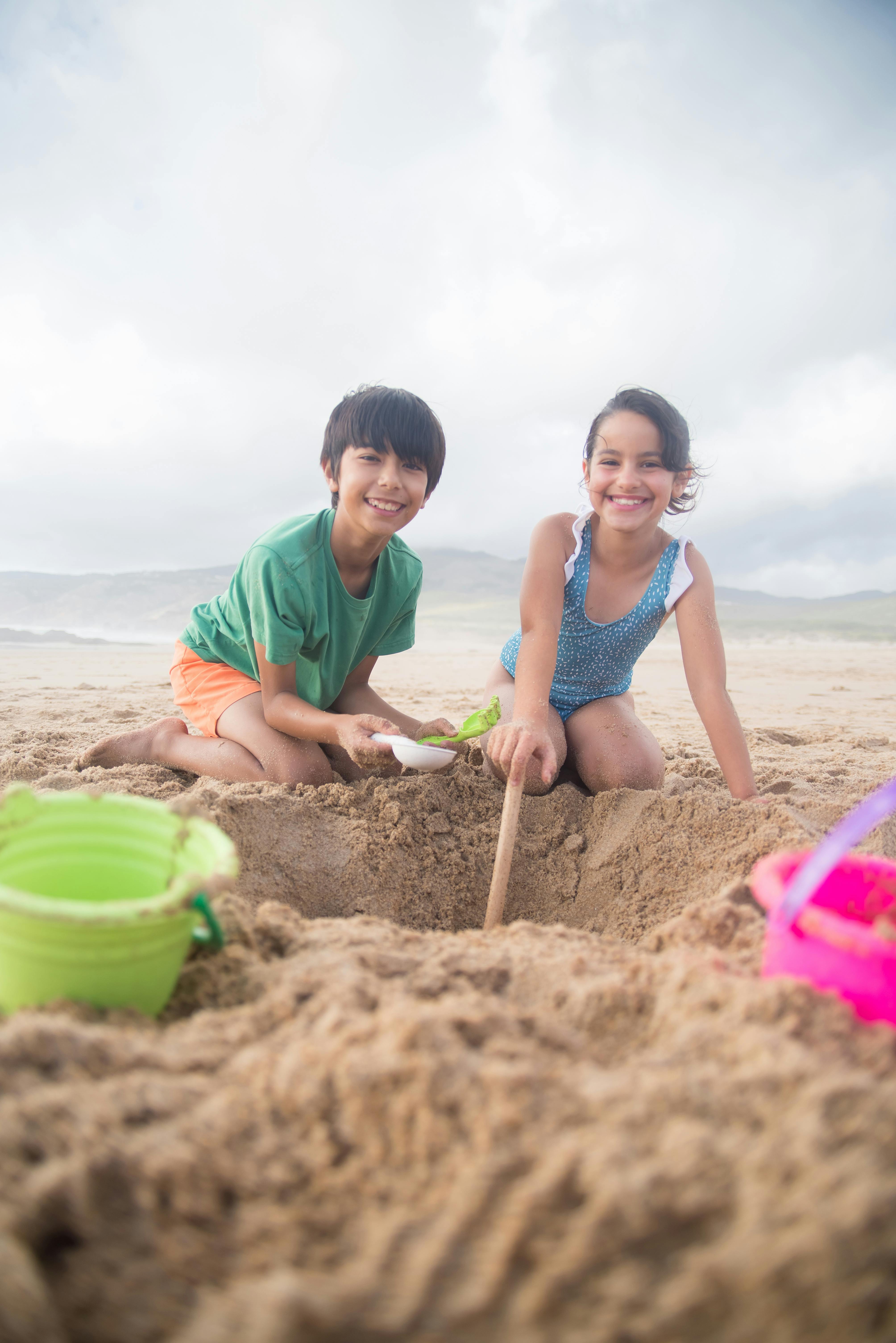 Kids Playing Sand on a Beach · Free Stock Photo