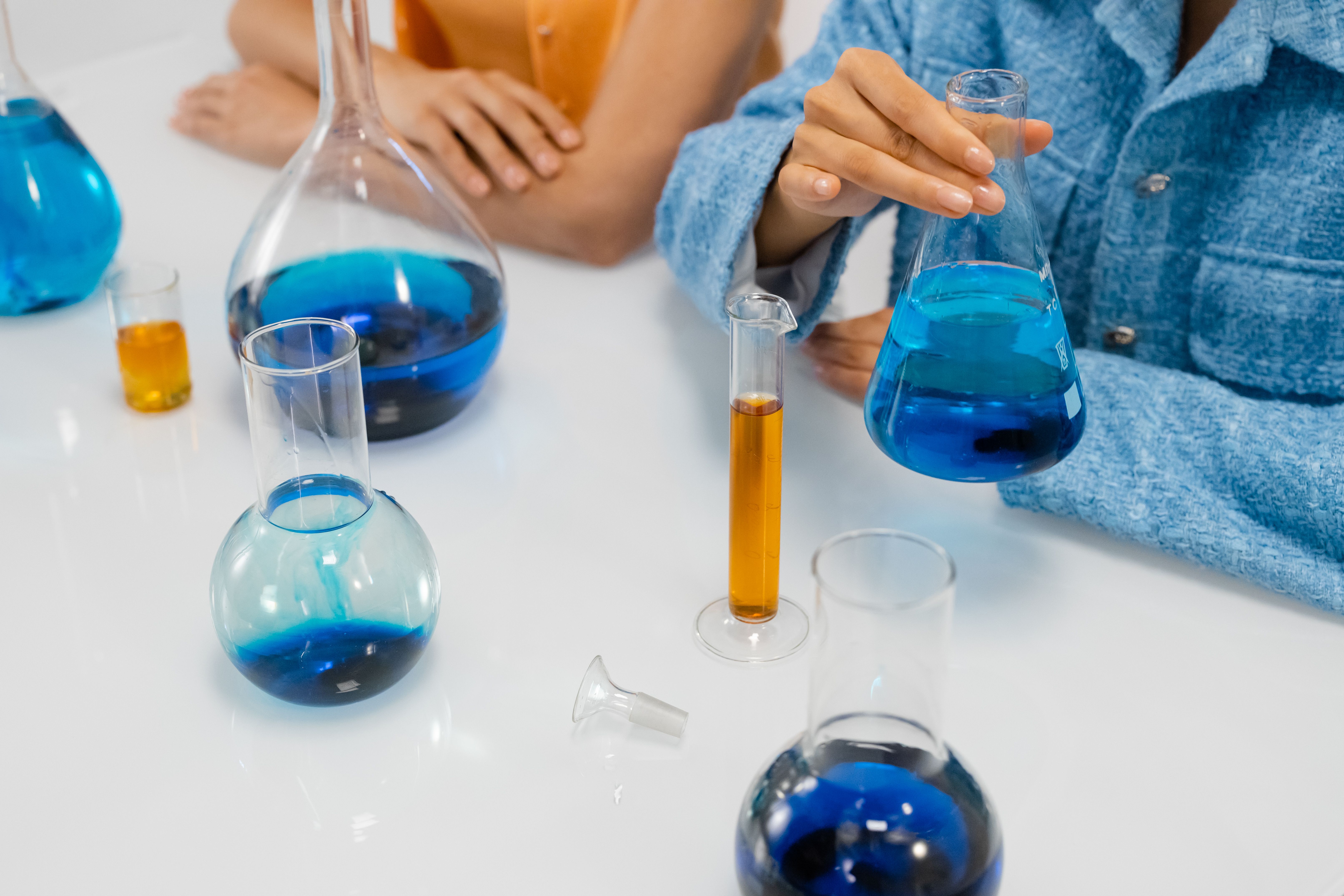 Person Holding an Erlenmeyer Flask · Free Stock Photo
