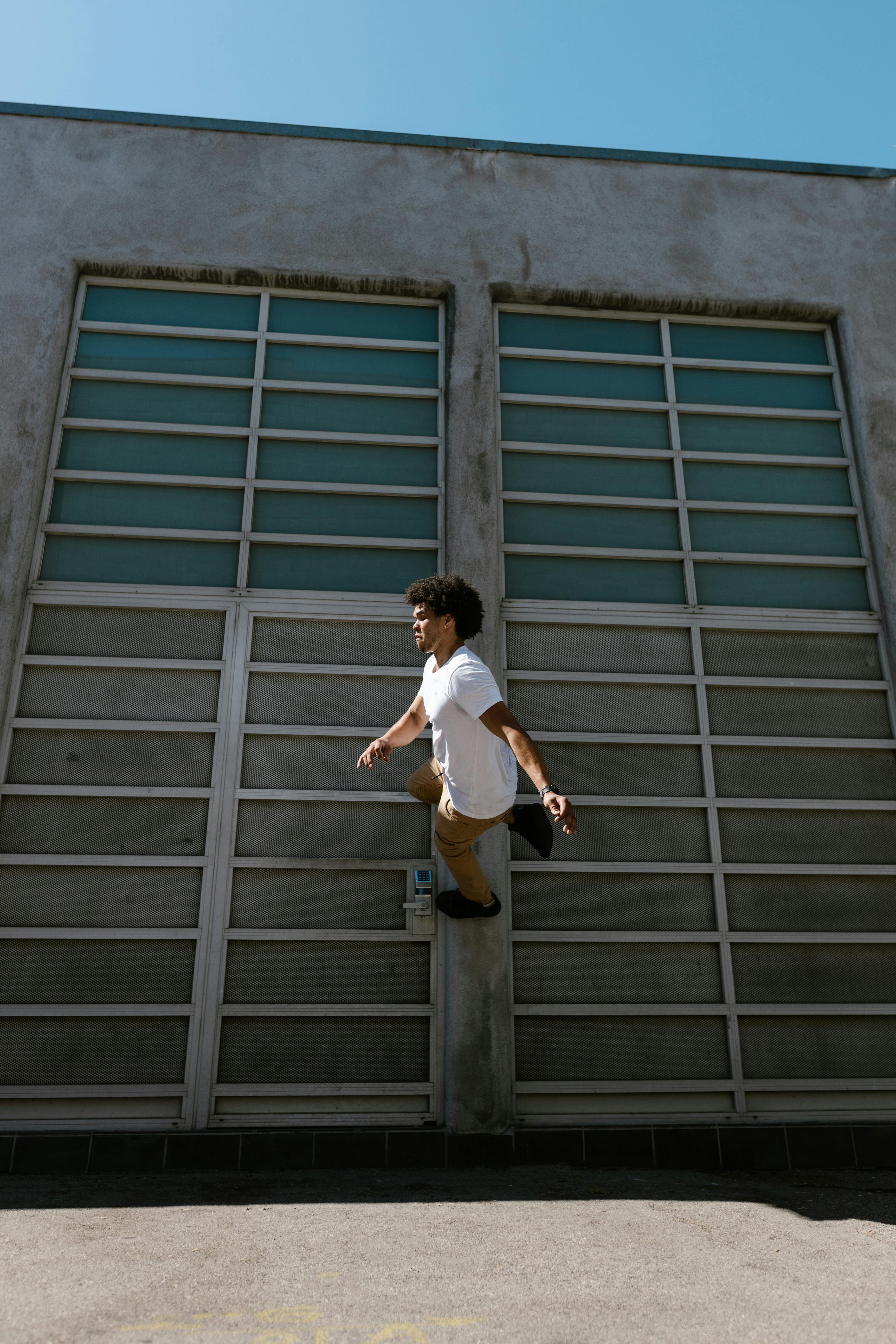 A Man Walking on a Wall · Free Stock Photo