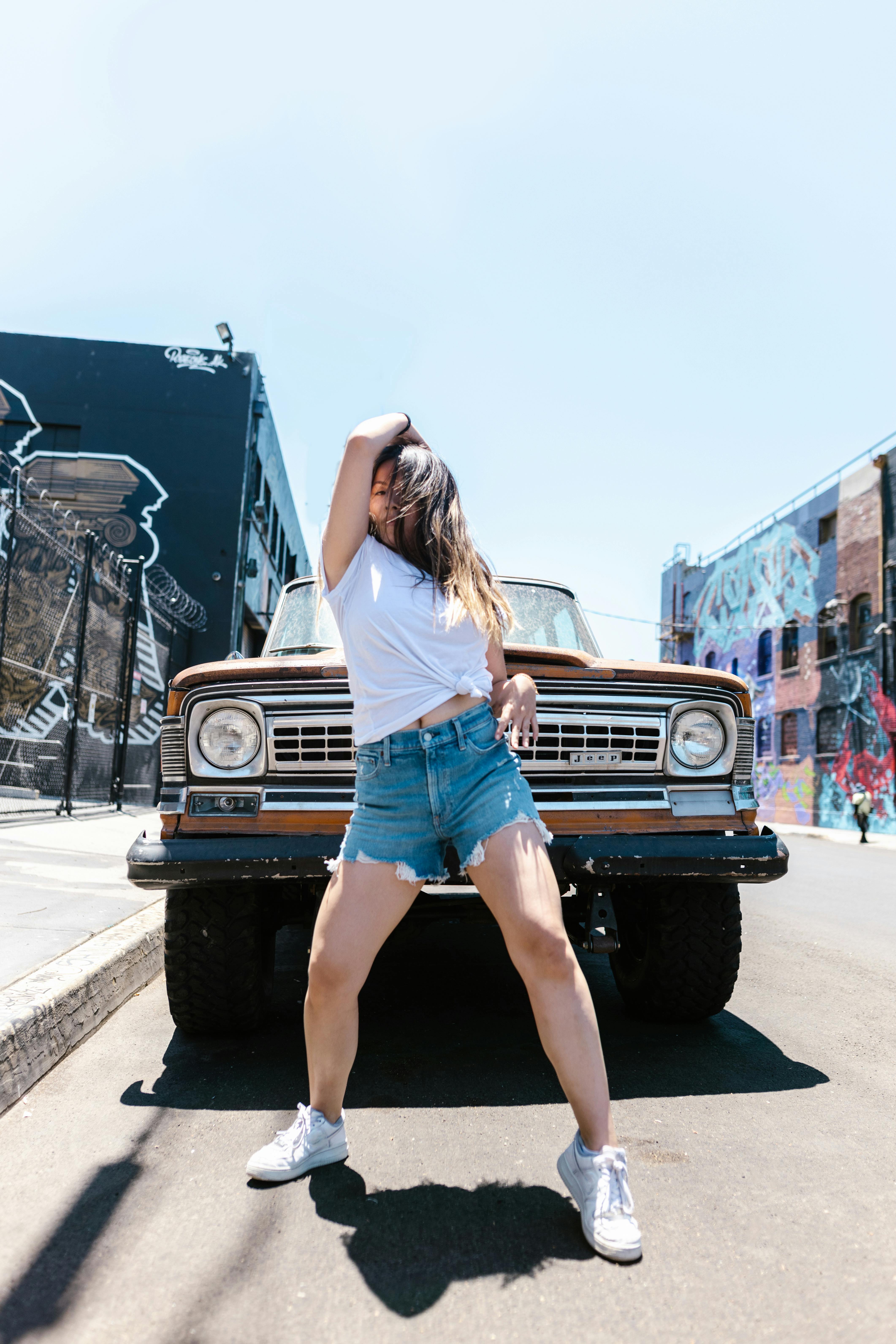 Girl in Pink Shirt and Denim Short Dancing · Free Stock Photo