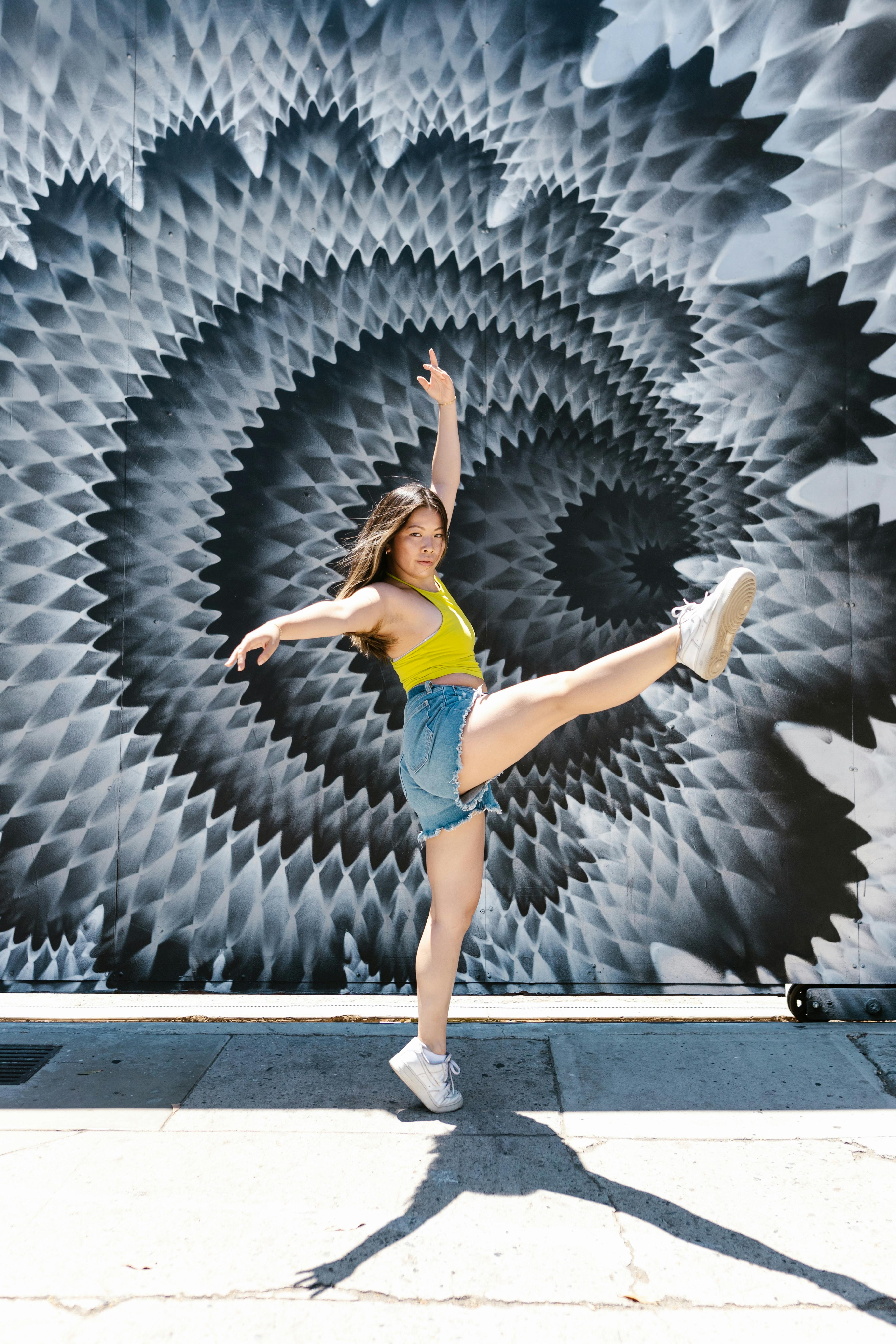 A Street Dancer in Front of a Graffiti Art · Free Stock Photo