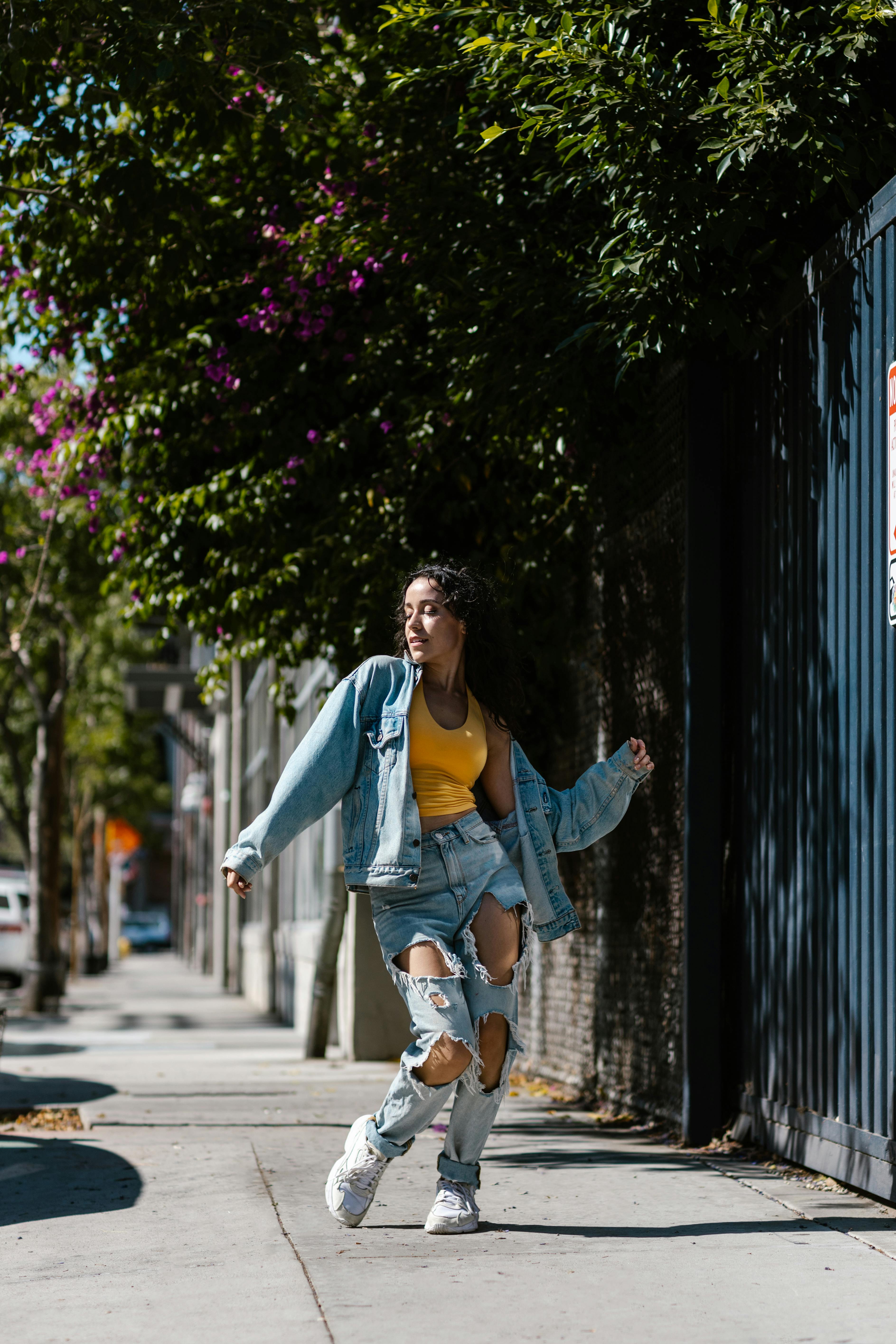Woman in Denim Jacket Dancing · Free Stock Photo