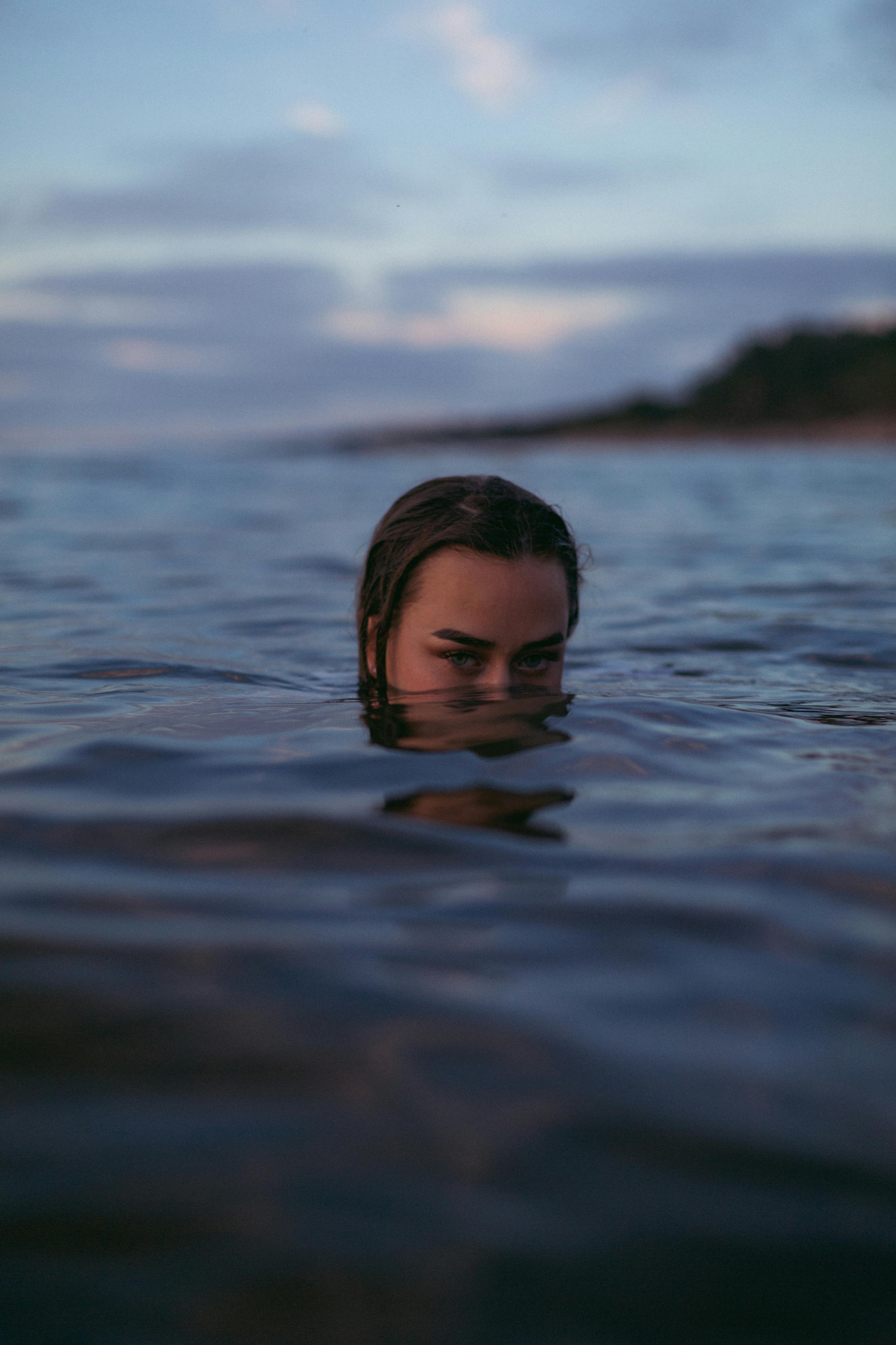 Beautiful Woman Swimming on See · Free Stock Photo