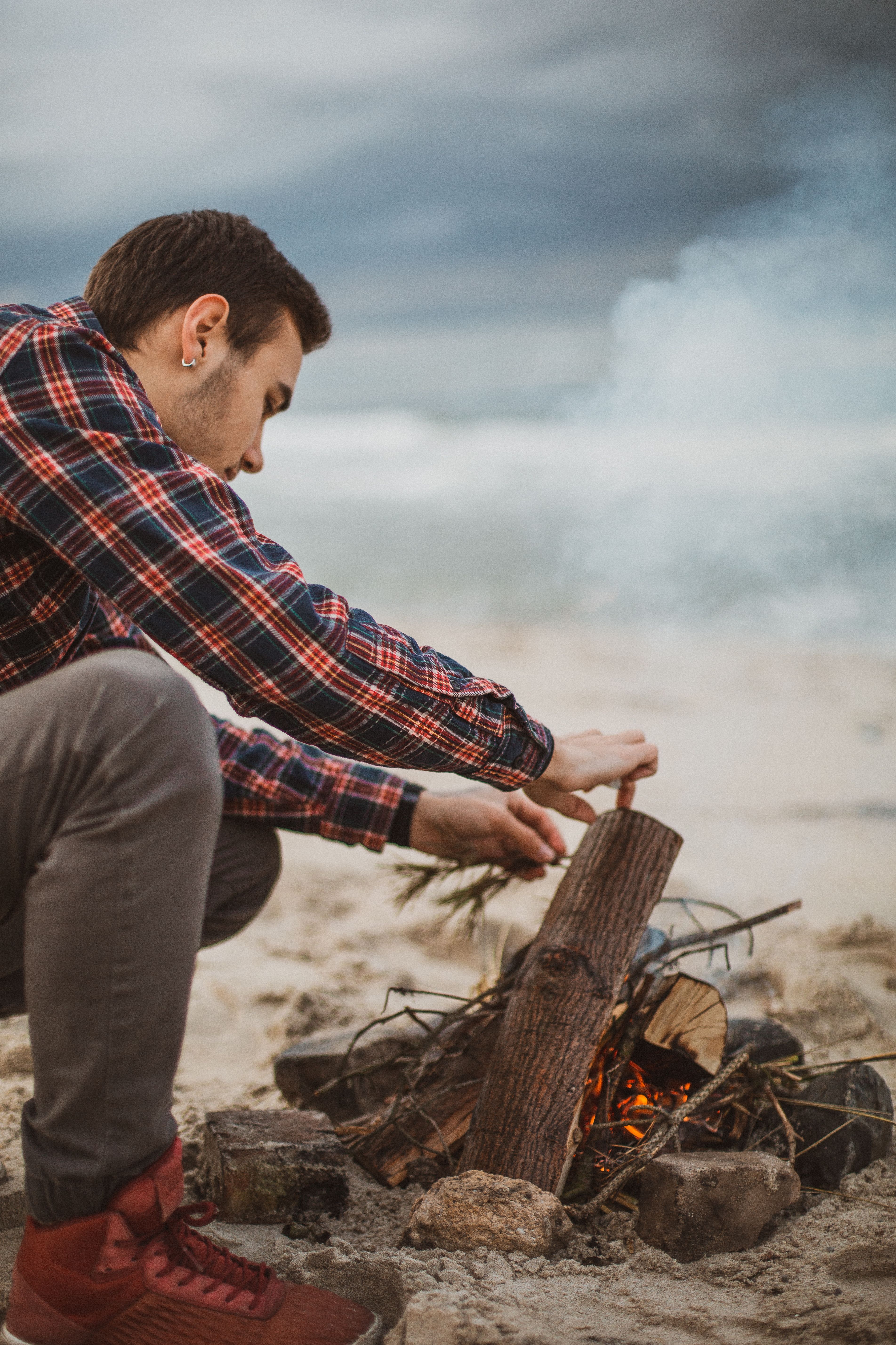 Man Holding Burning Paper · Free Stock Photo