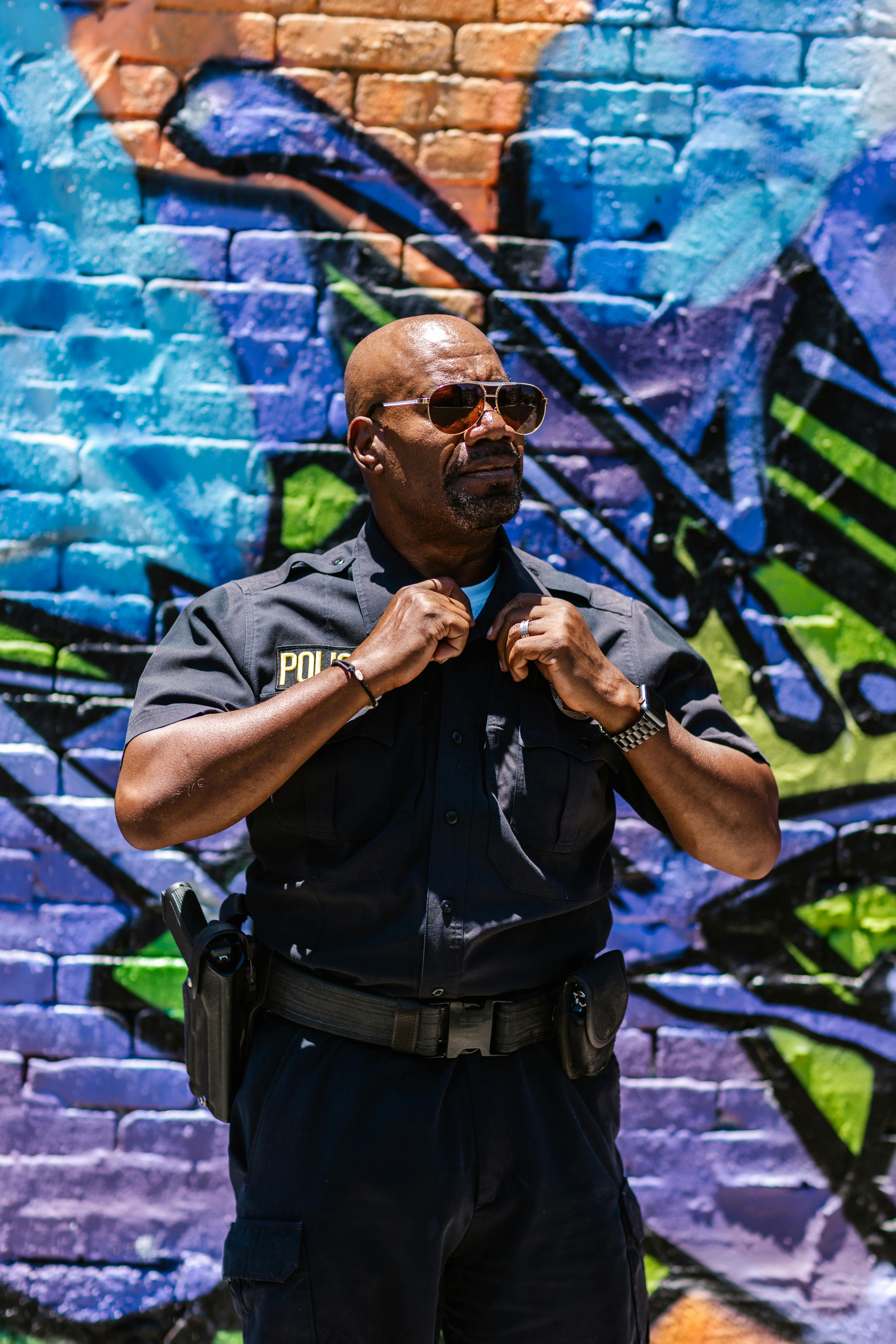 A Police Officer Standing on the Street · Free Stock Photo