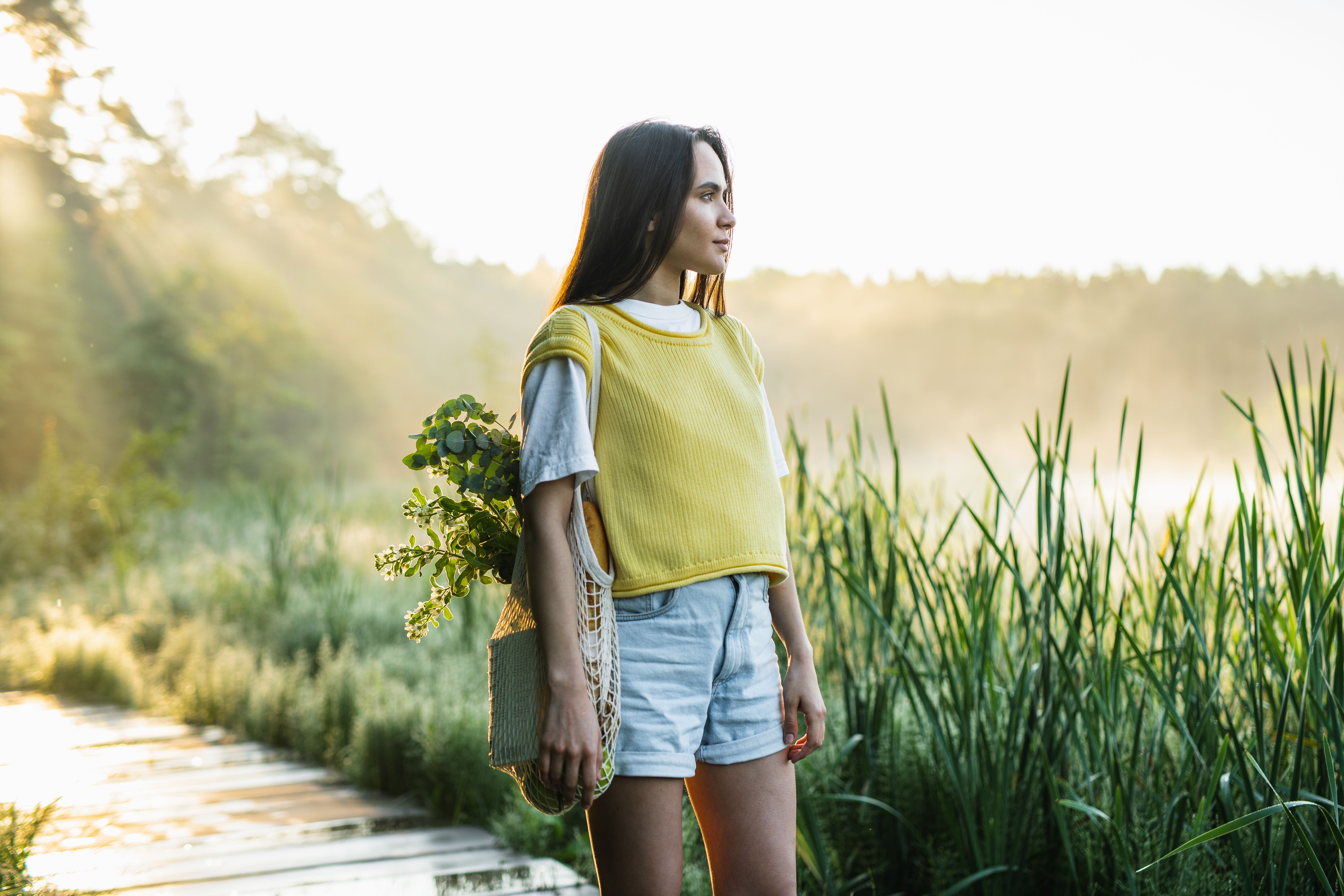 A Woman in a Yellow Knitted Vest · Free Stock Photo