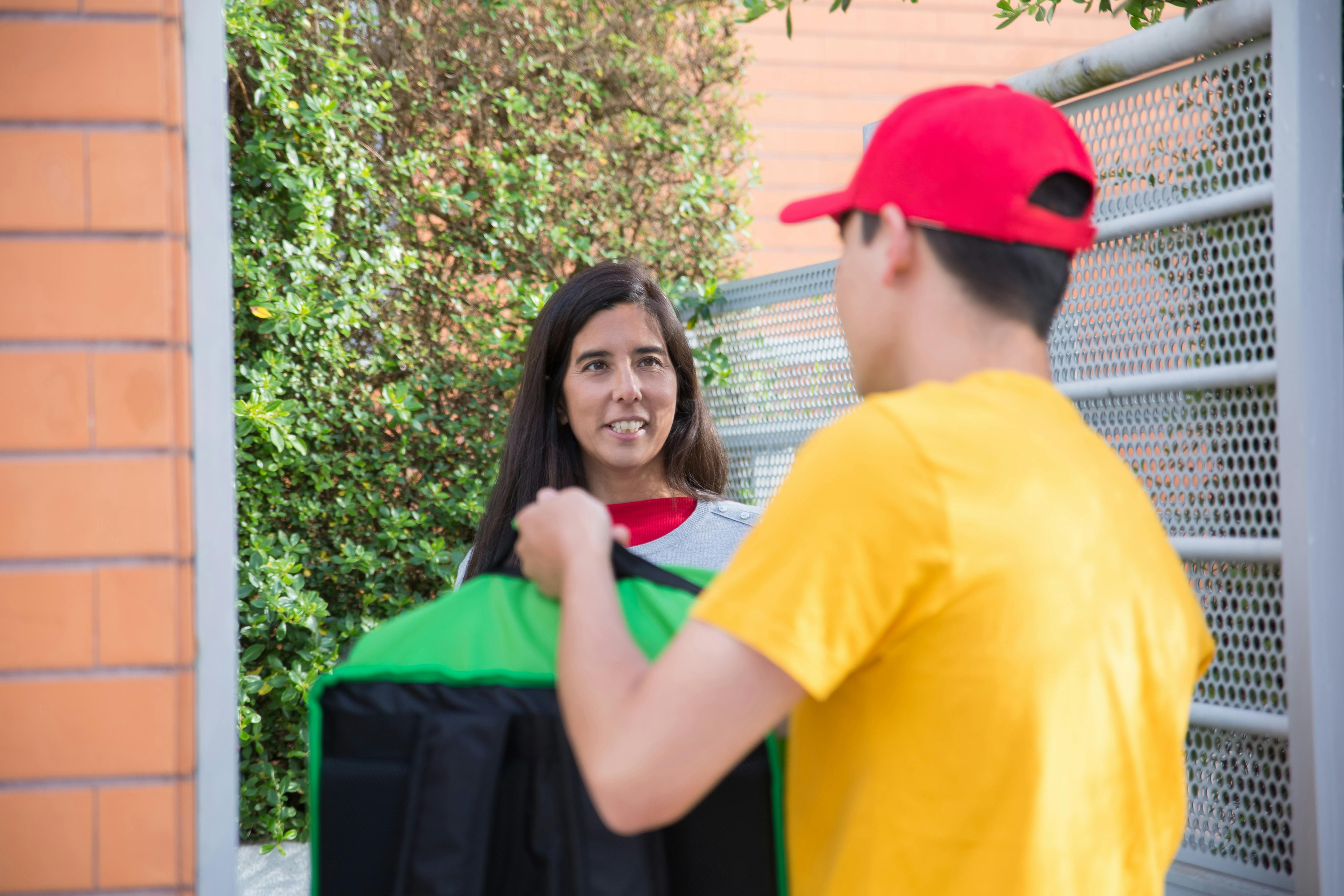 A Woman Receiving Delivery · Free Stock Photo