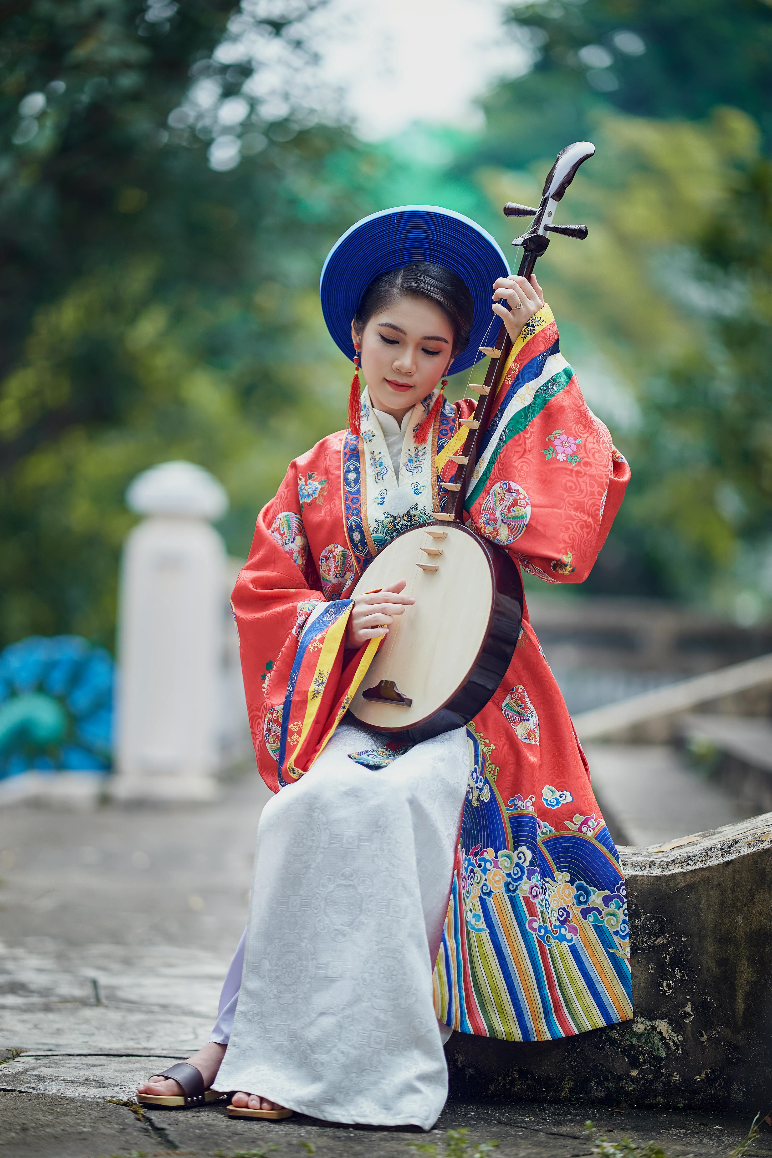 Woman Playing Traditional Instrument · Free Stock Photo