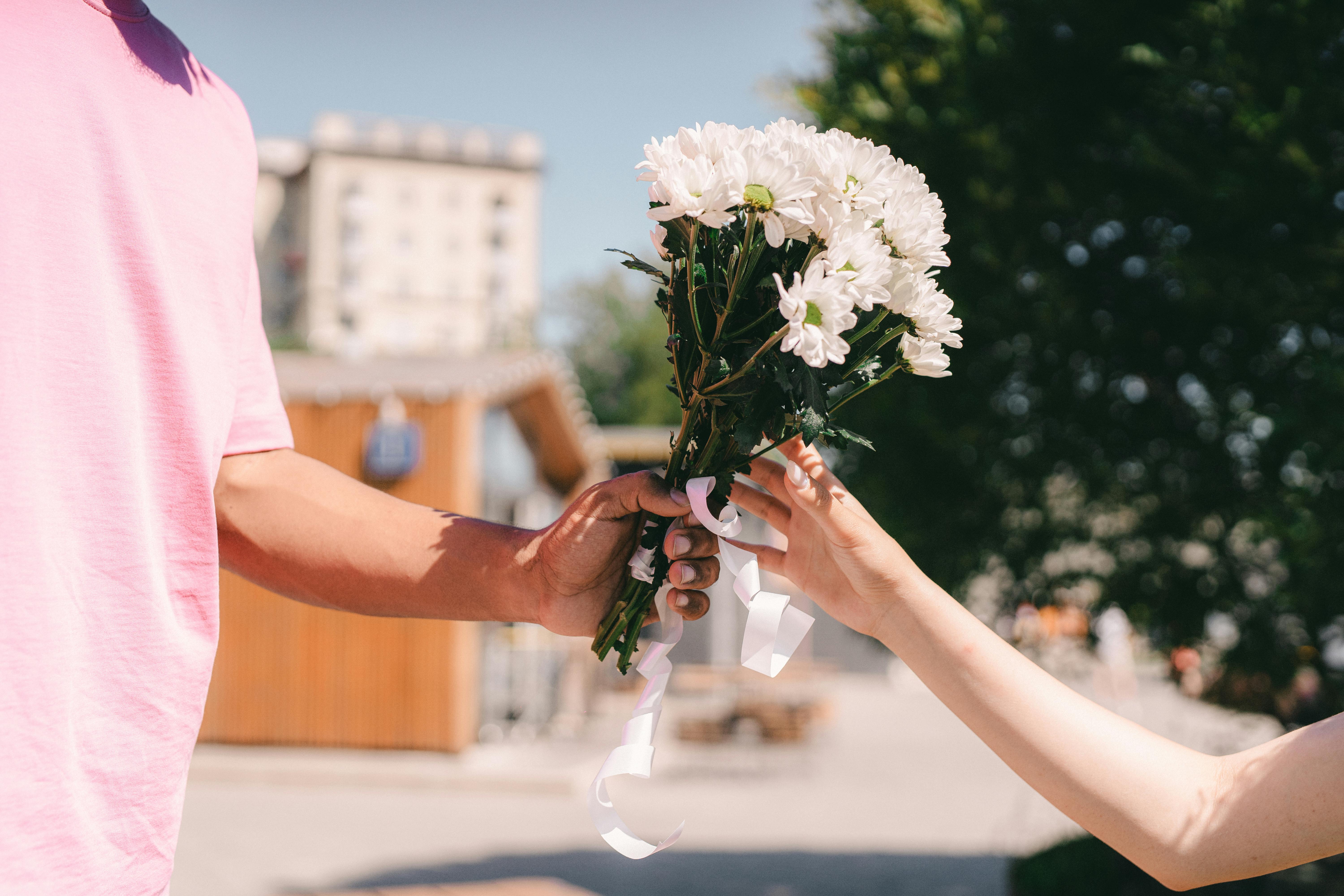 Person Holding White Flower Bouquet · Free Stock Photo