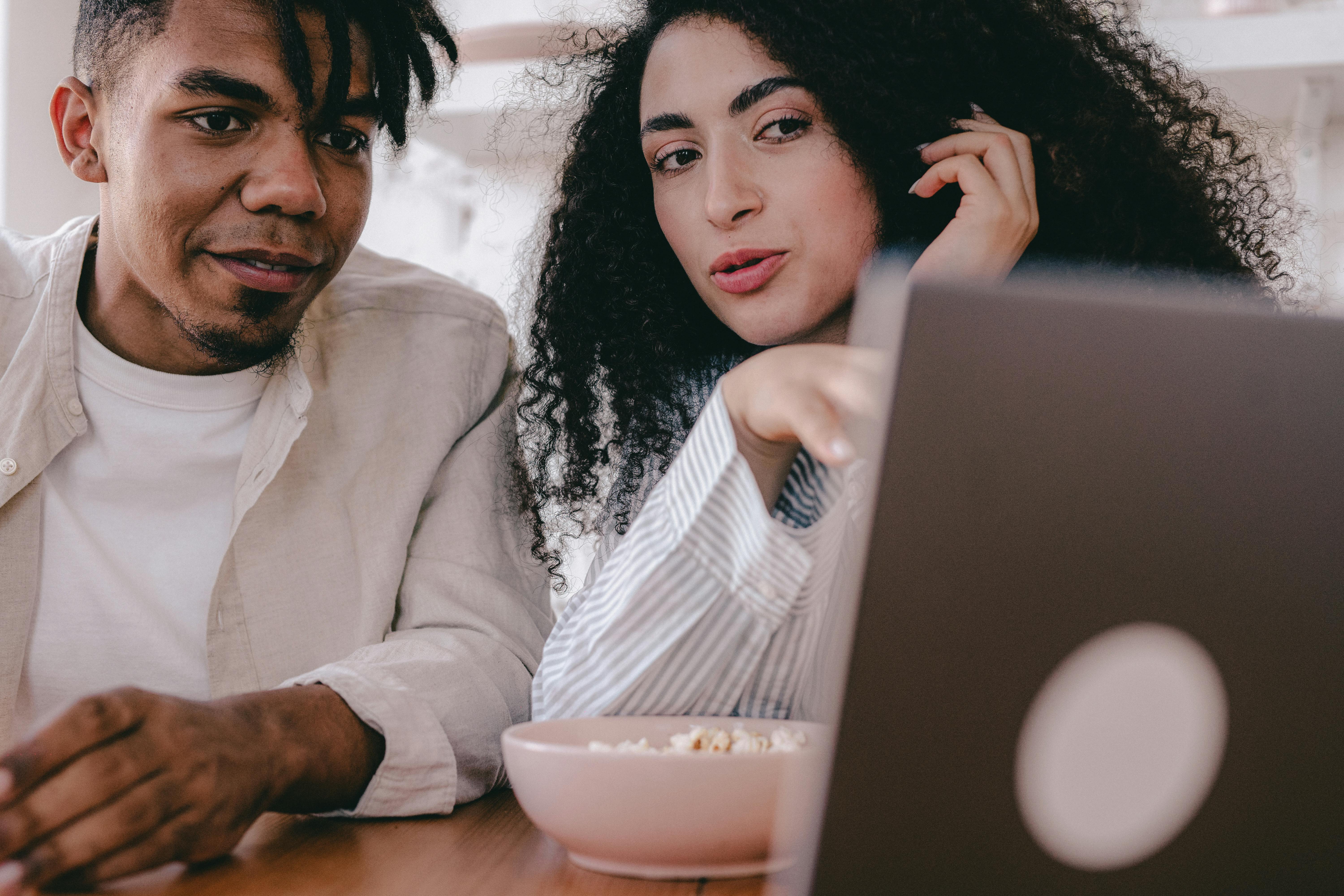 Couple Watching on a Laptop · Free Stock Photo