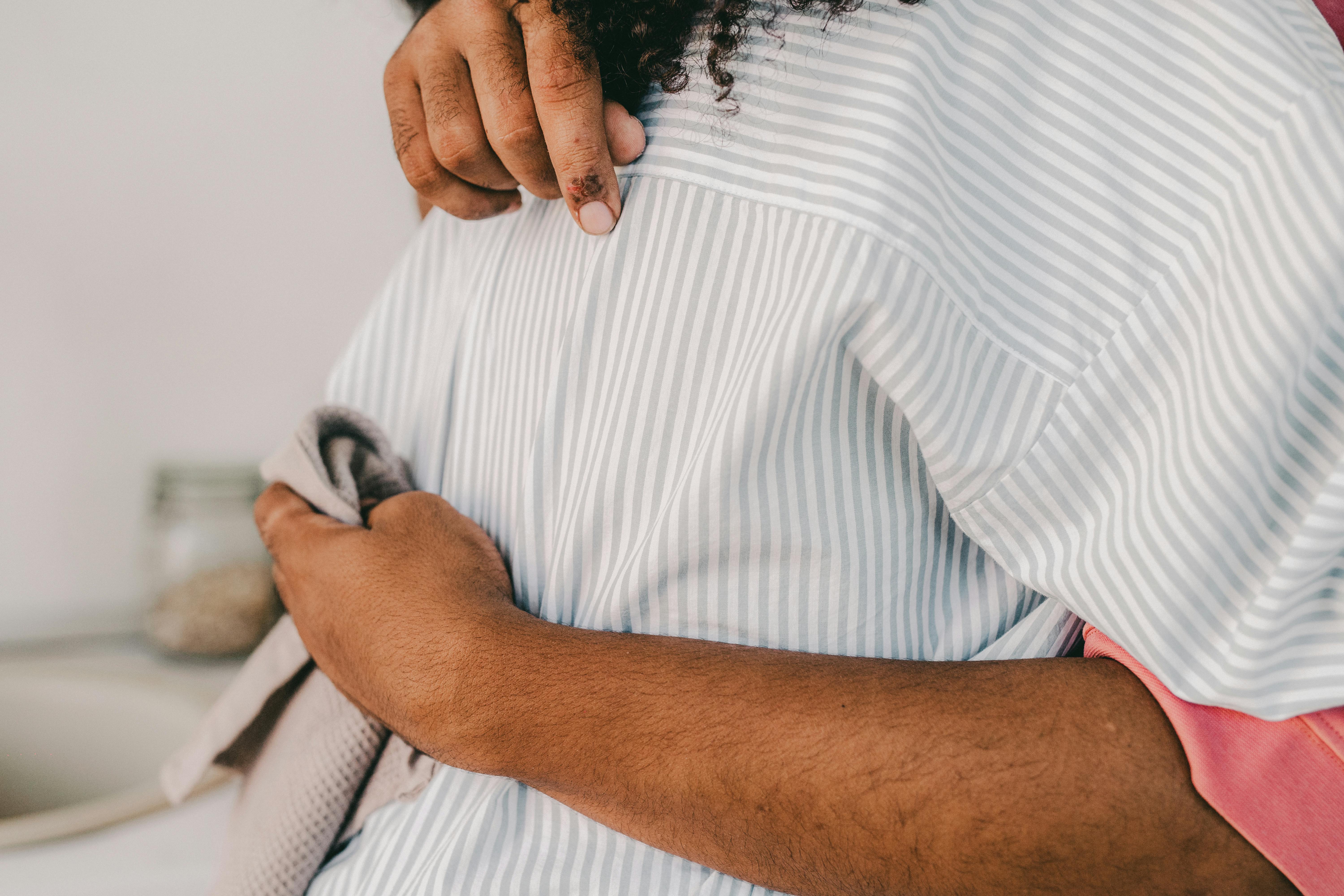 Person in Pink Shirt Hugging Person in Gray and White Shirt · Free ...