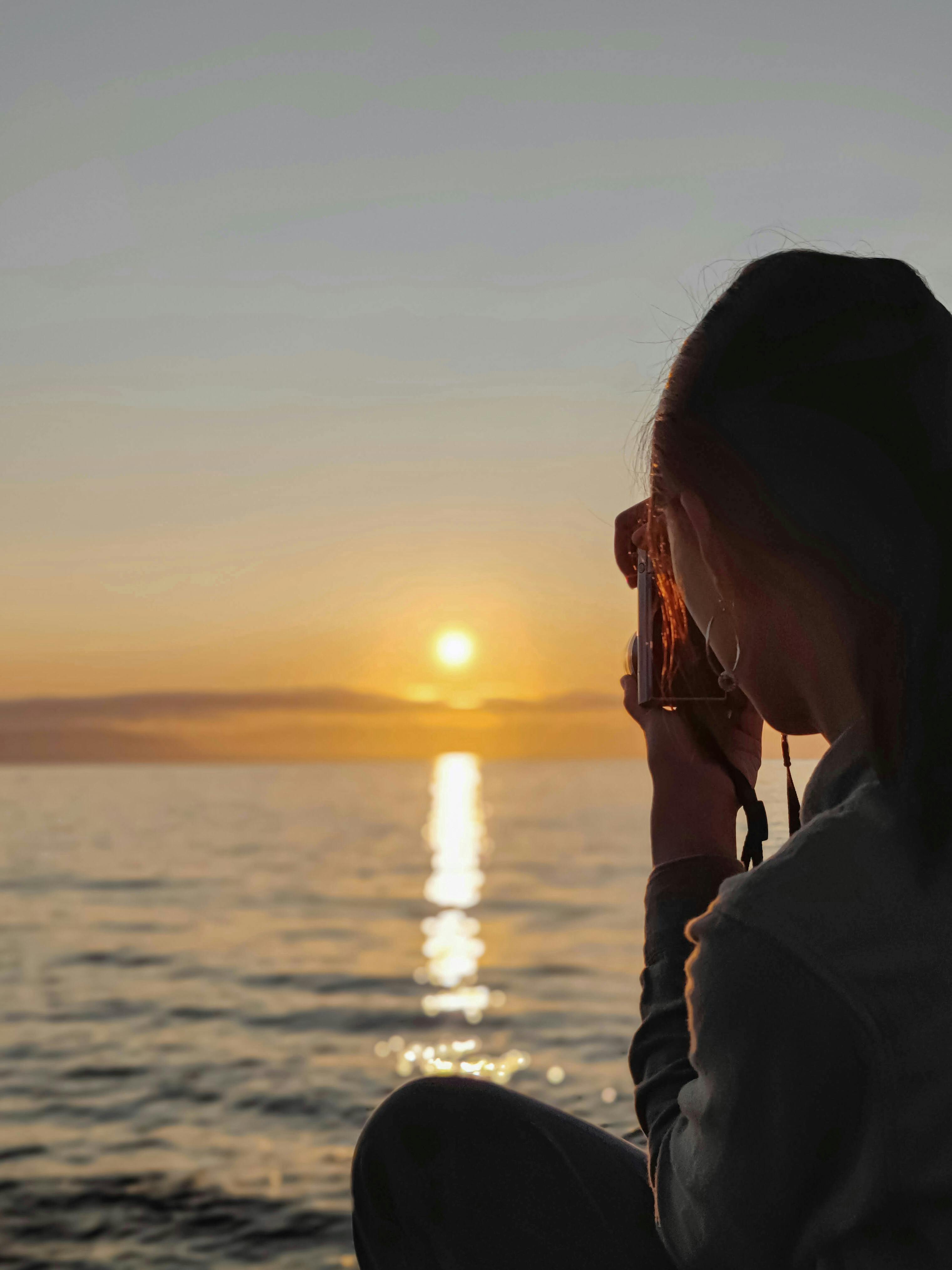 Woman on the Beach at Sunset · Free Stock Photo