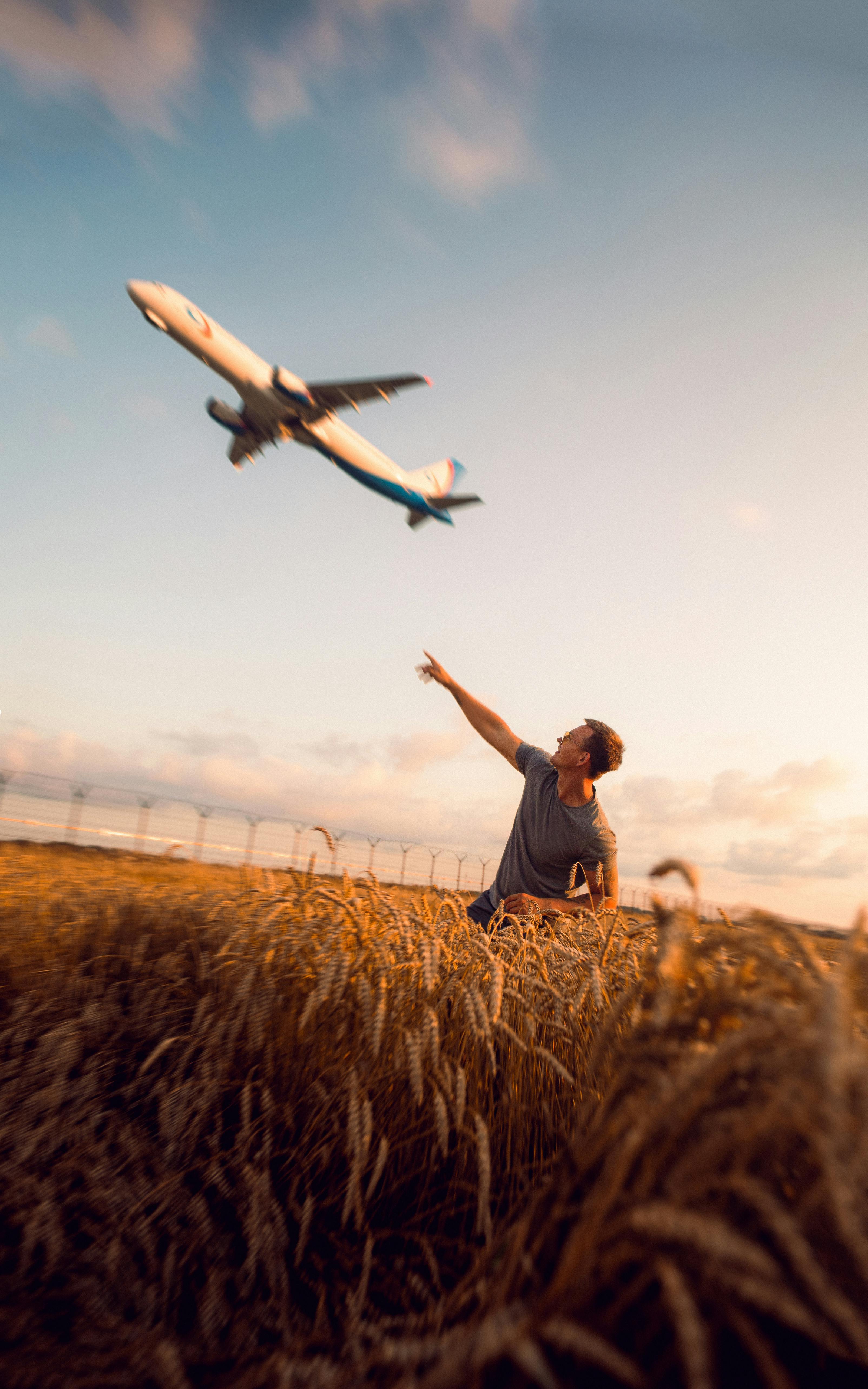 Man Pointing at Airplane · Free Stock Photo