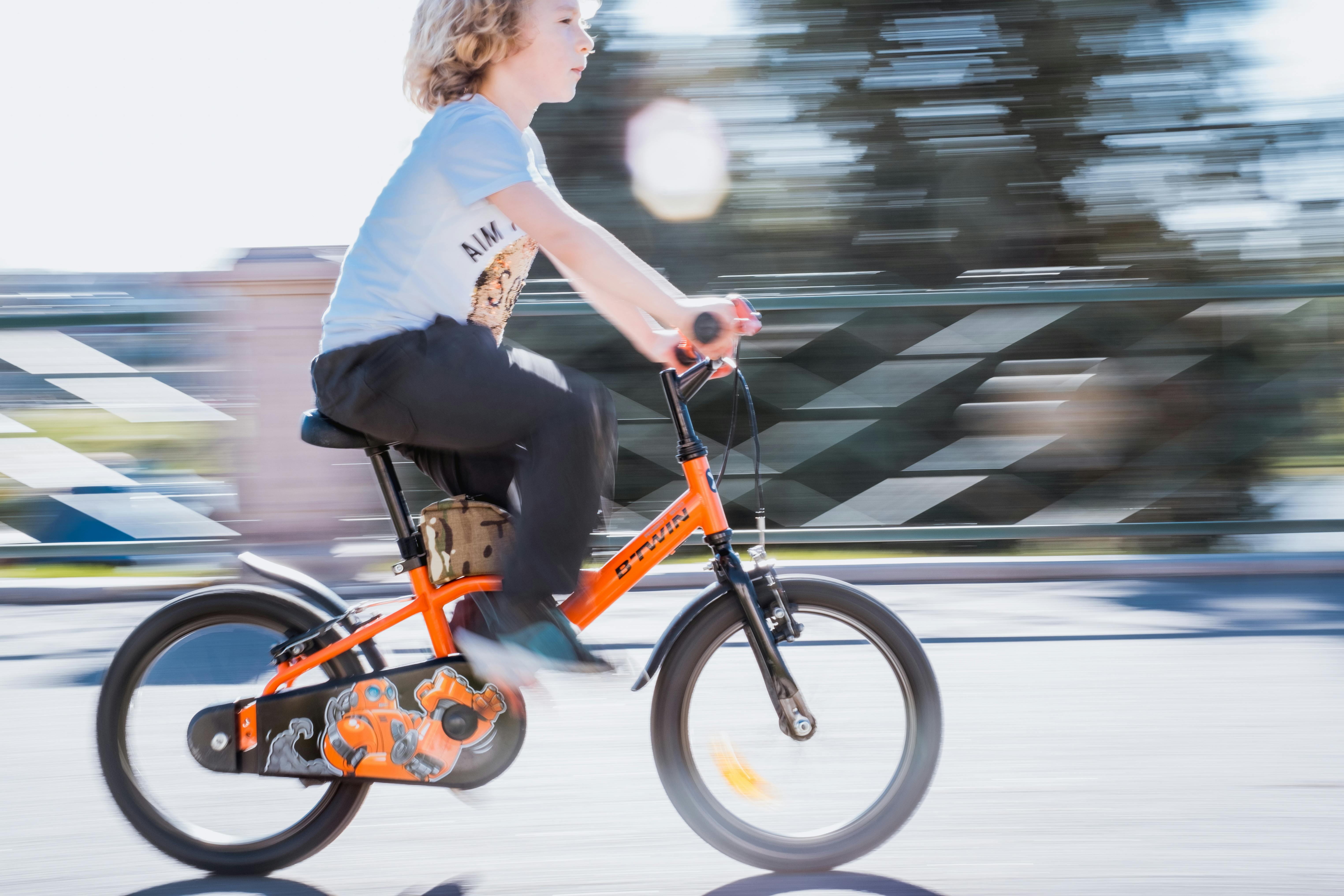 Time Lapse Photo of a Boy Riding a Bicycle · Free Stock Photo