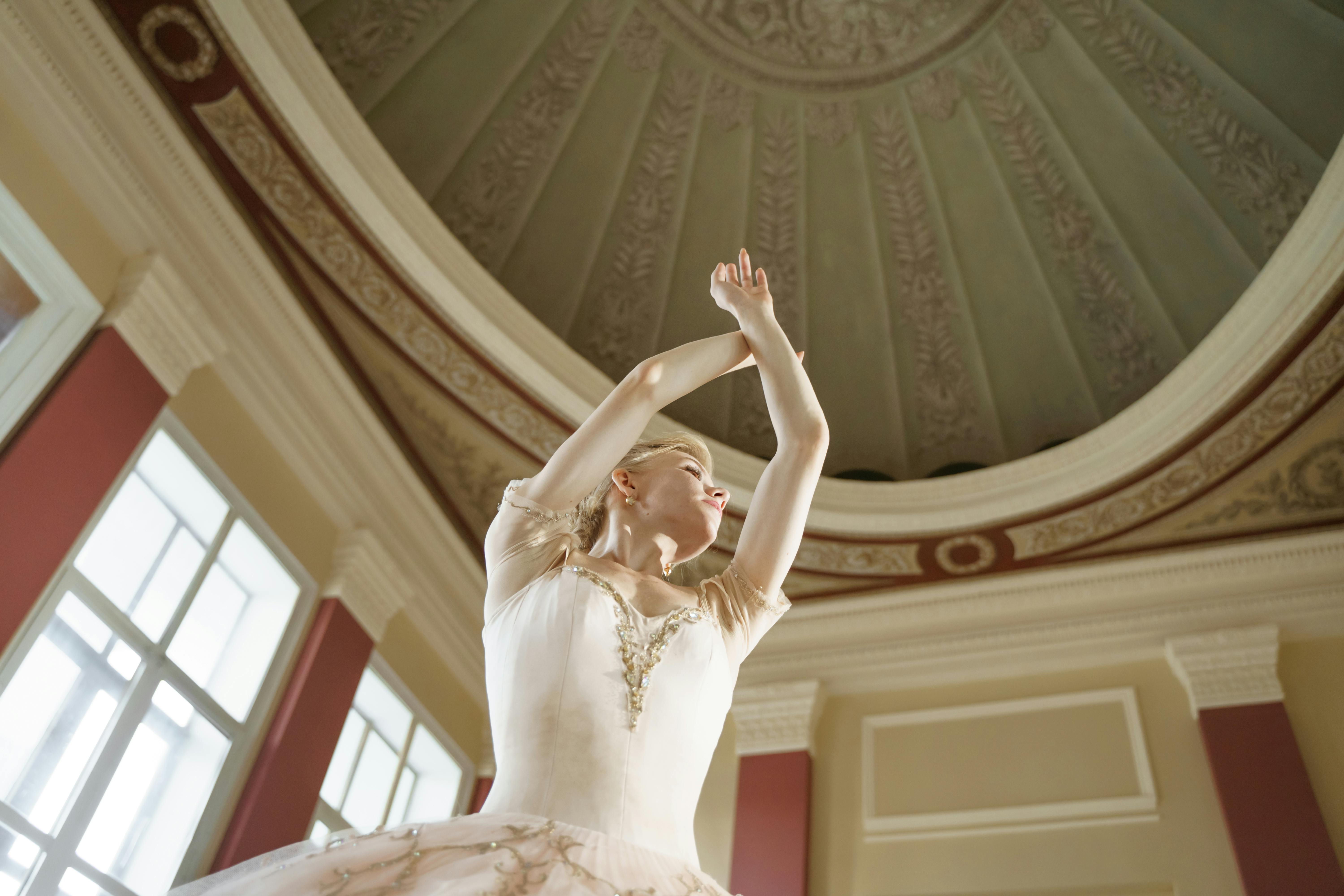 Low-Angle Shot of a Woman Dancing · Free Stock Photo