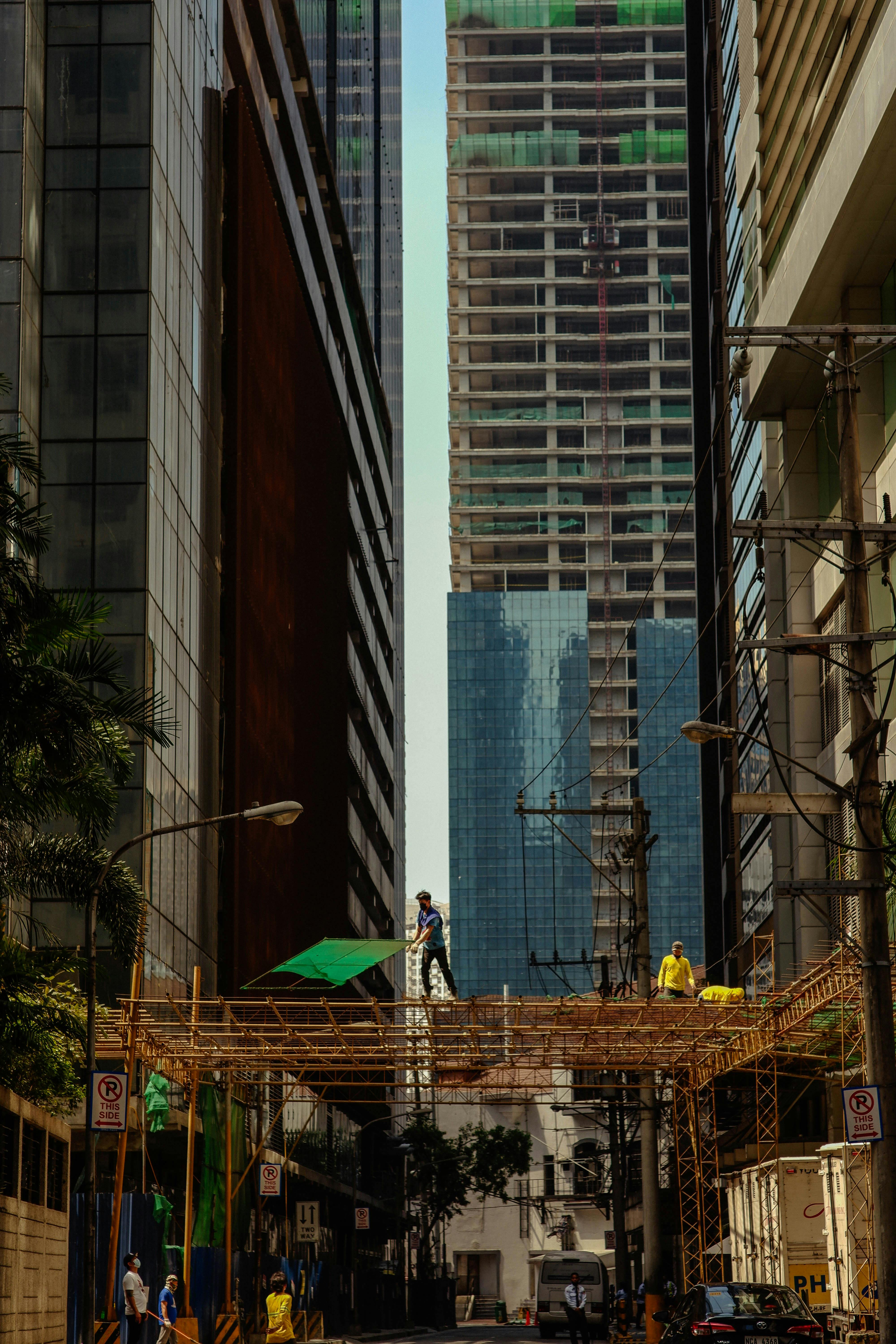 Building Construction Between City Buildings · Free Stock Photo