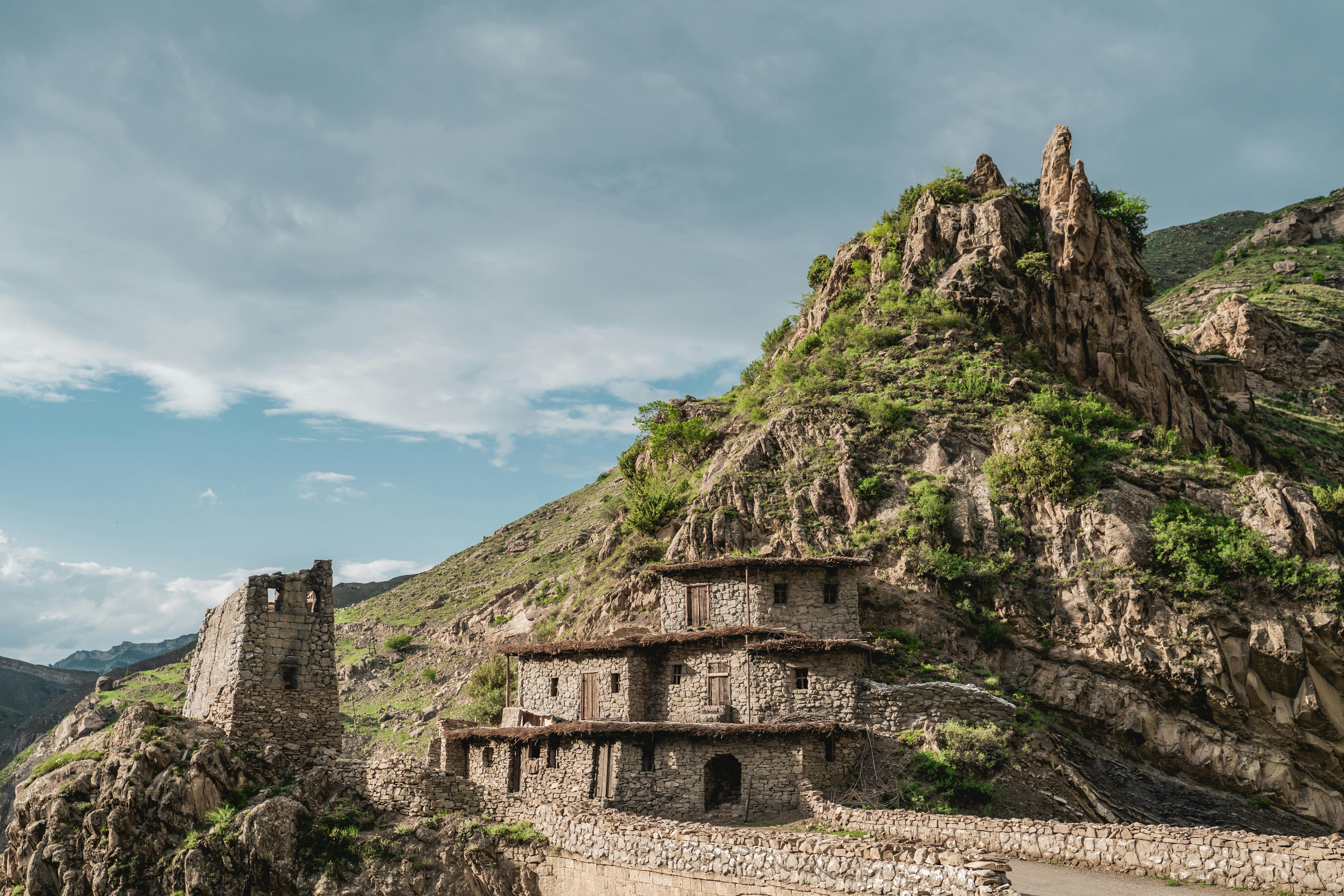 An Old Building on a Side of a Mountain · Free Stock Photo
