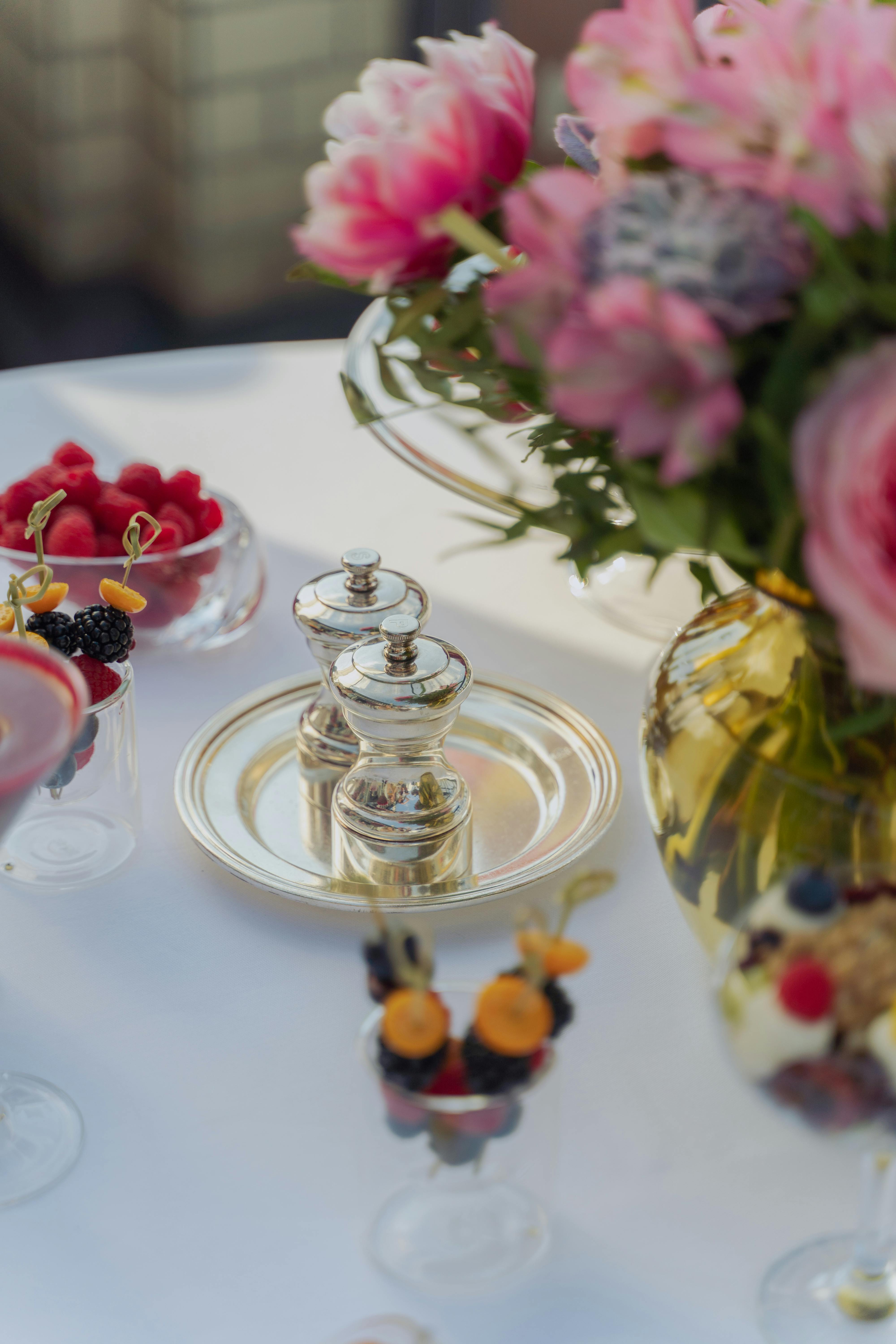 Salt and Pepper Shakers on a Table · Free Stock Photo