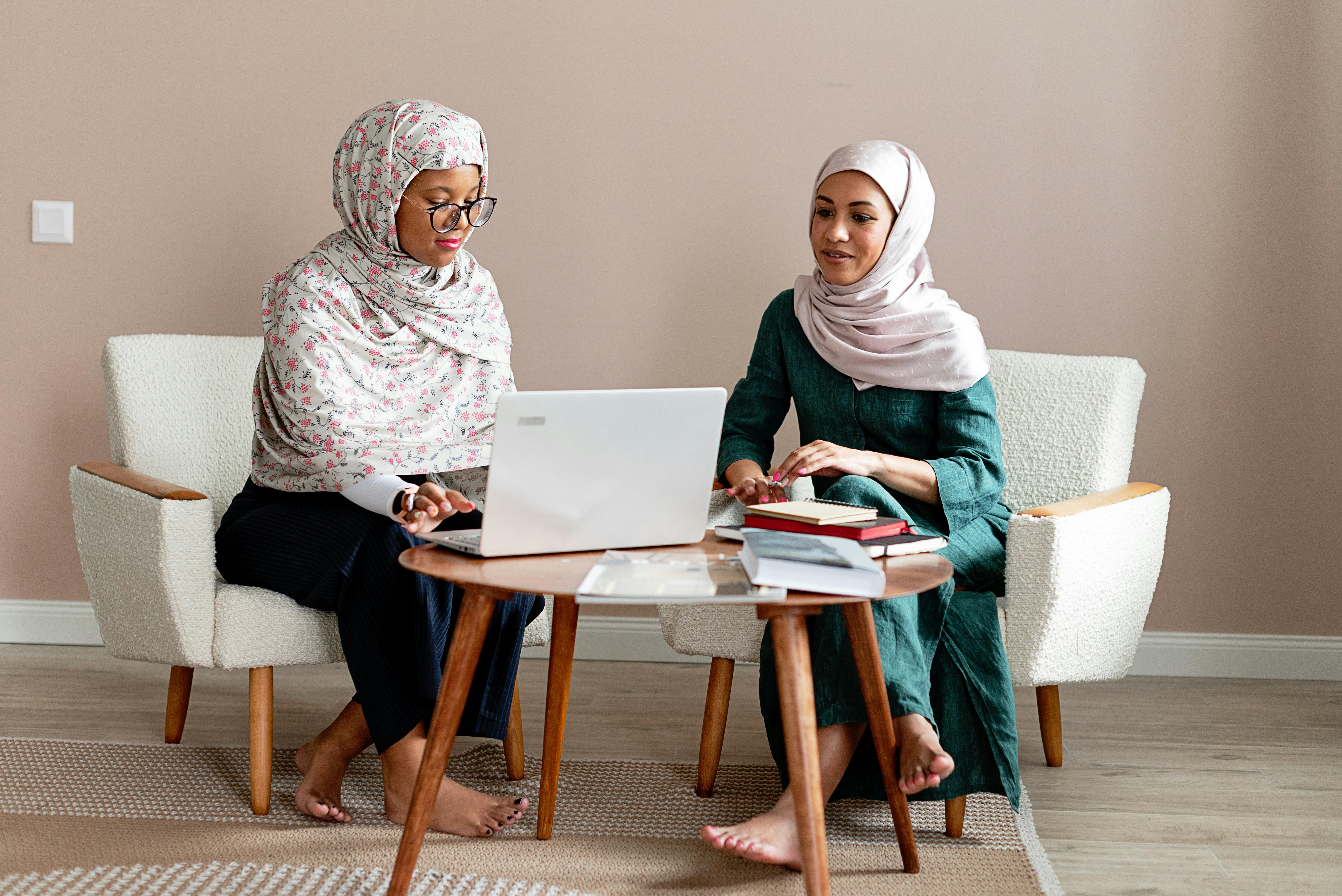 Woman in White Hijab Sitting on Chair · Free Stock Photo