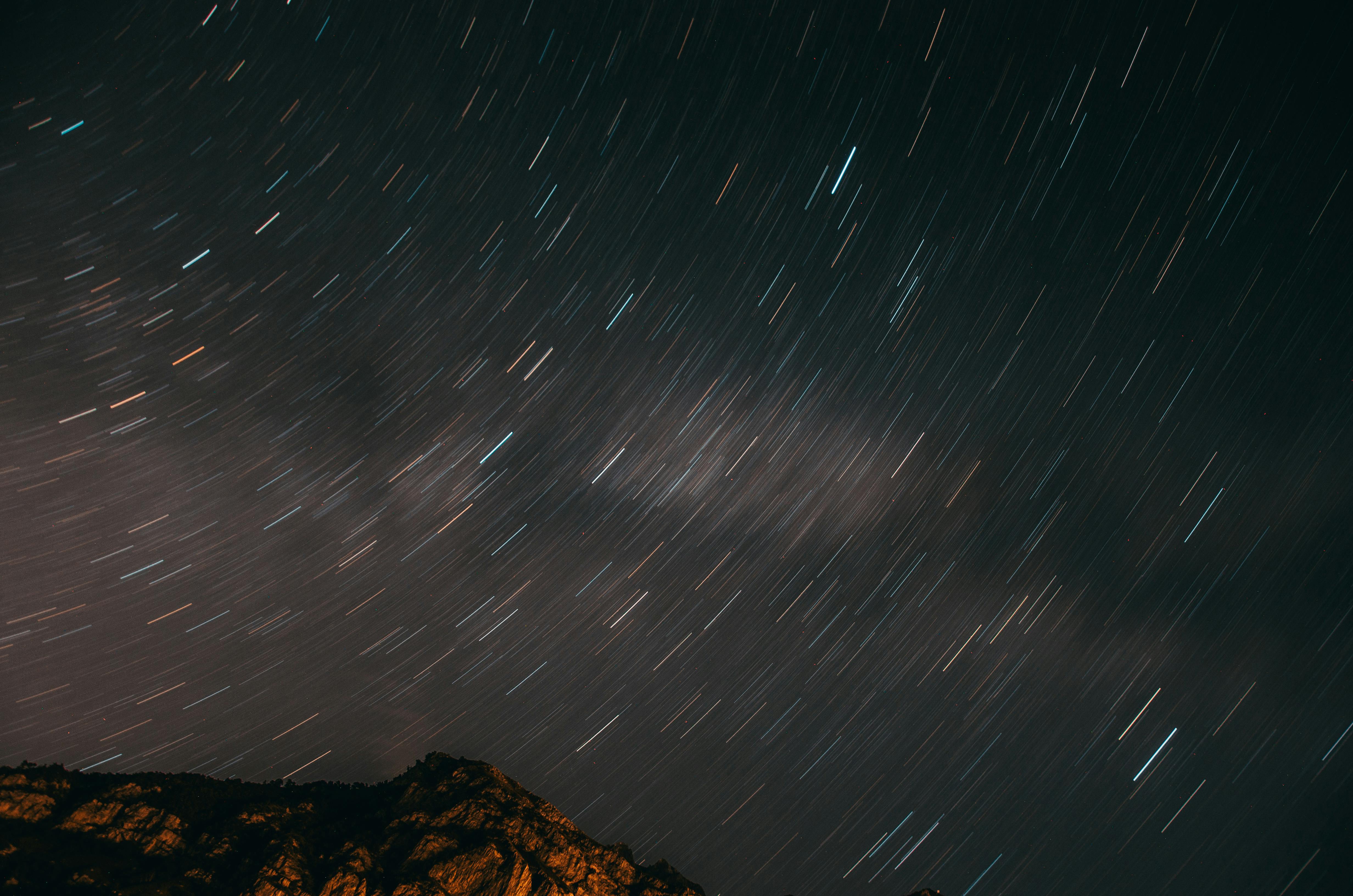 Light Streaks of Stars on Night Sky · Free Stock Photo