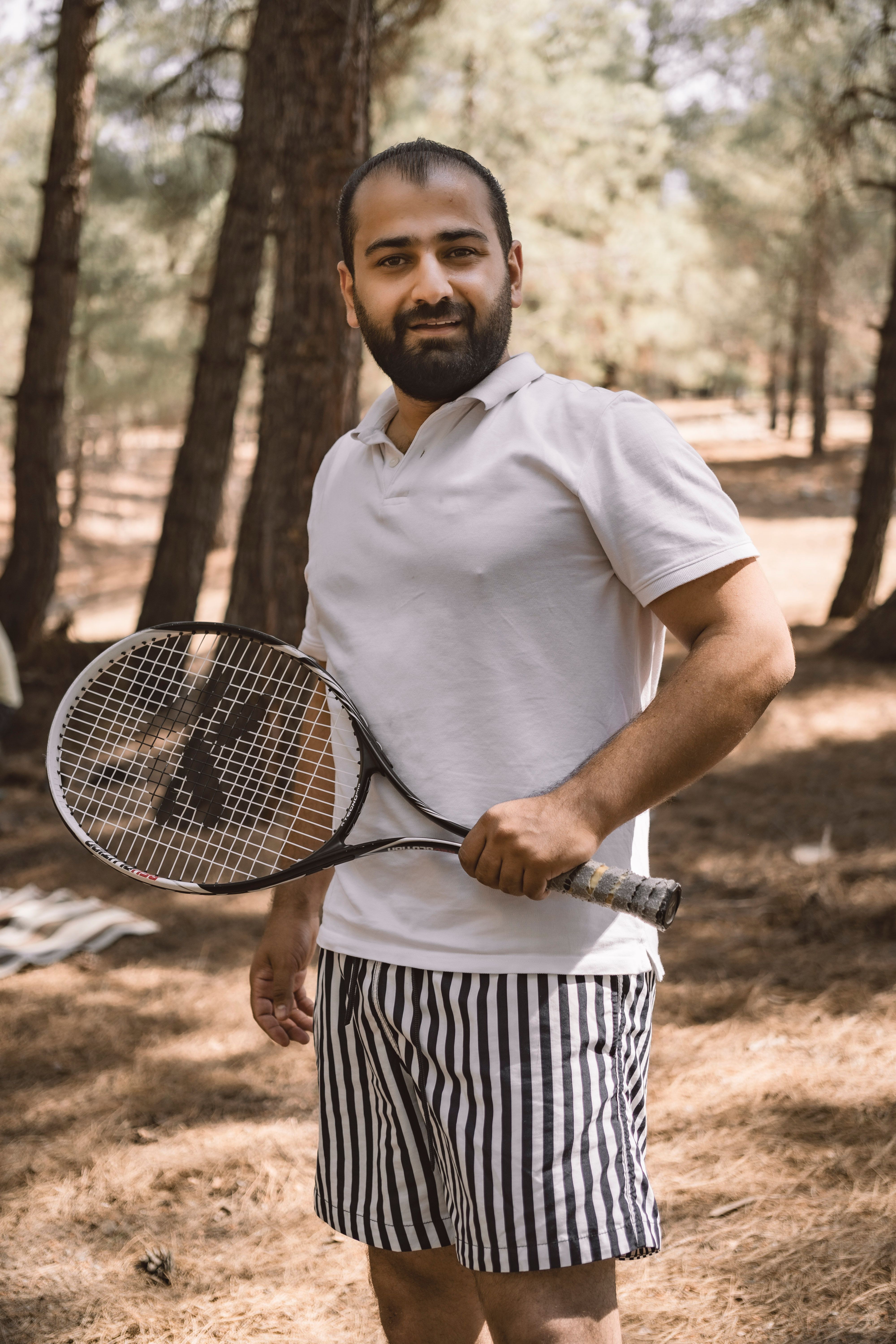 A Man Holding a Tennis Racket · Free Stock Photo