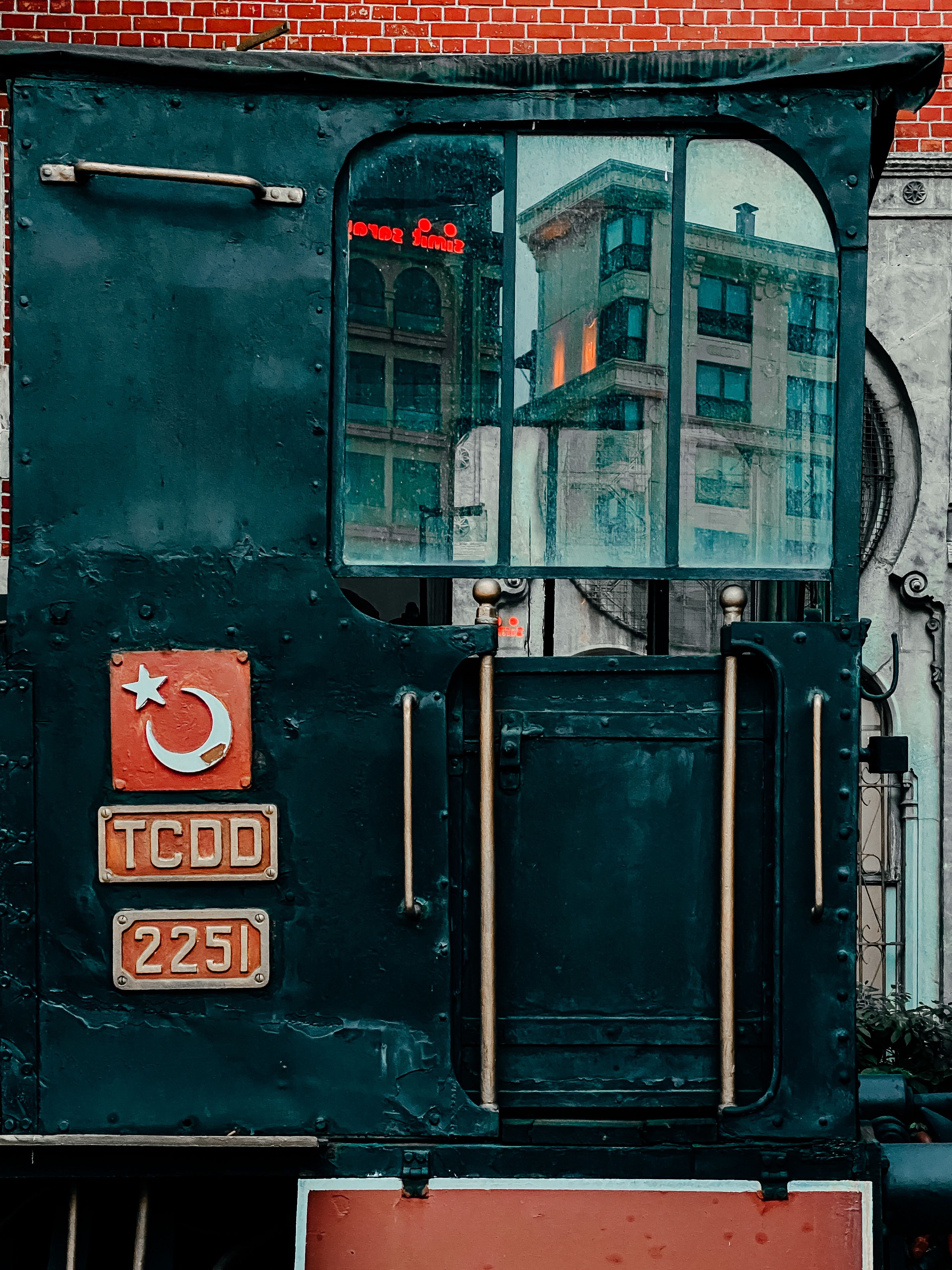 Buildings Reflection over a Train Window · Free Stock Photo