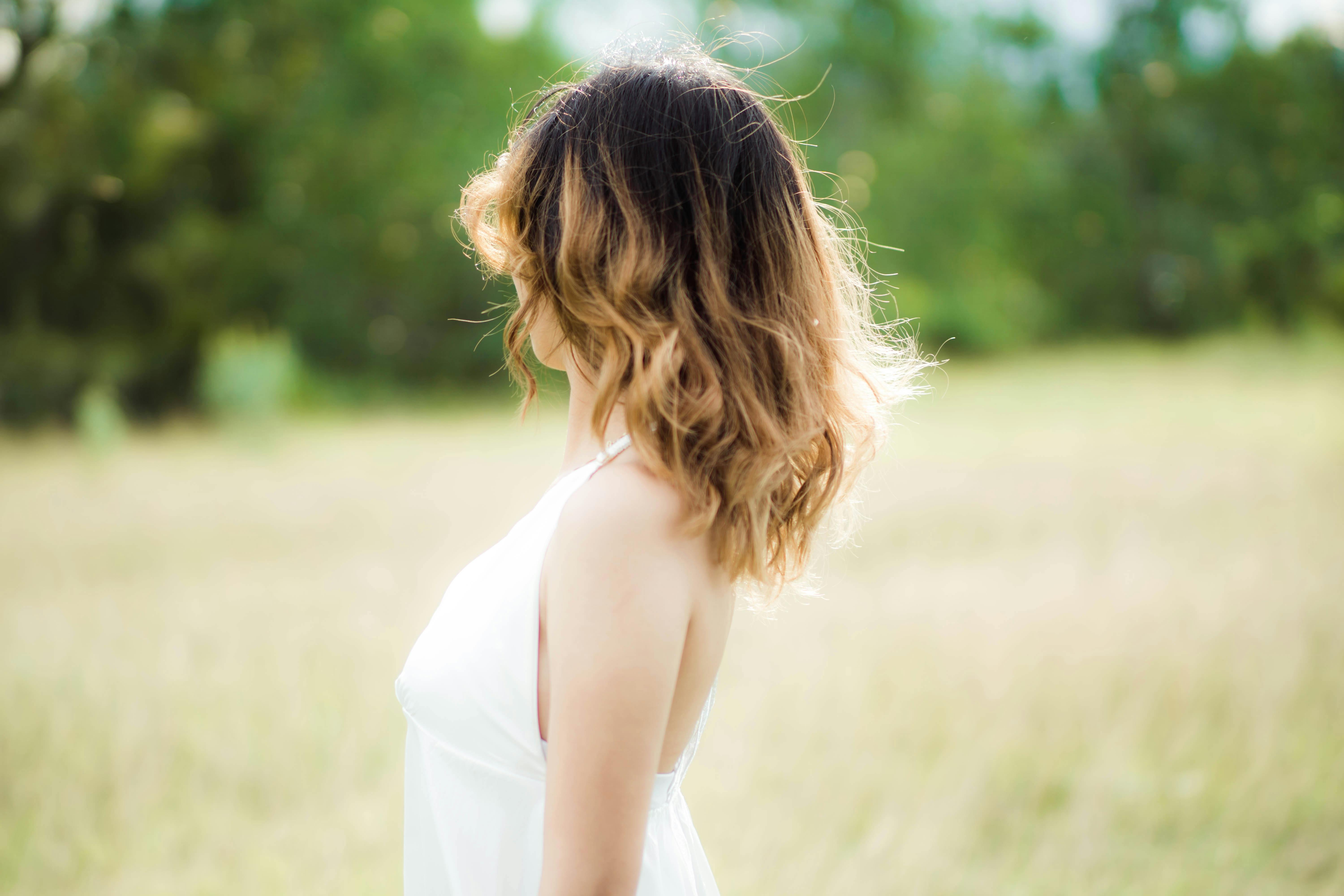 Close-Up Photo of Person combing a Hair · Free Stock Photo