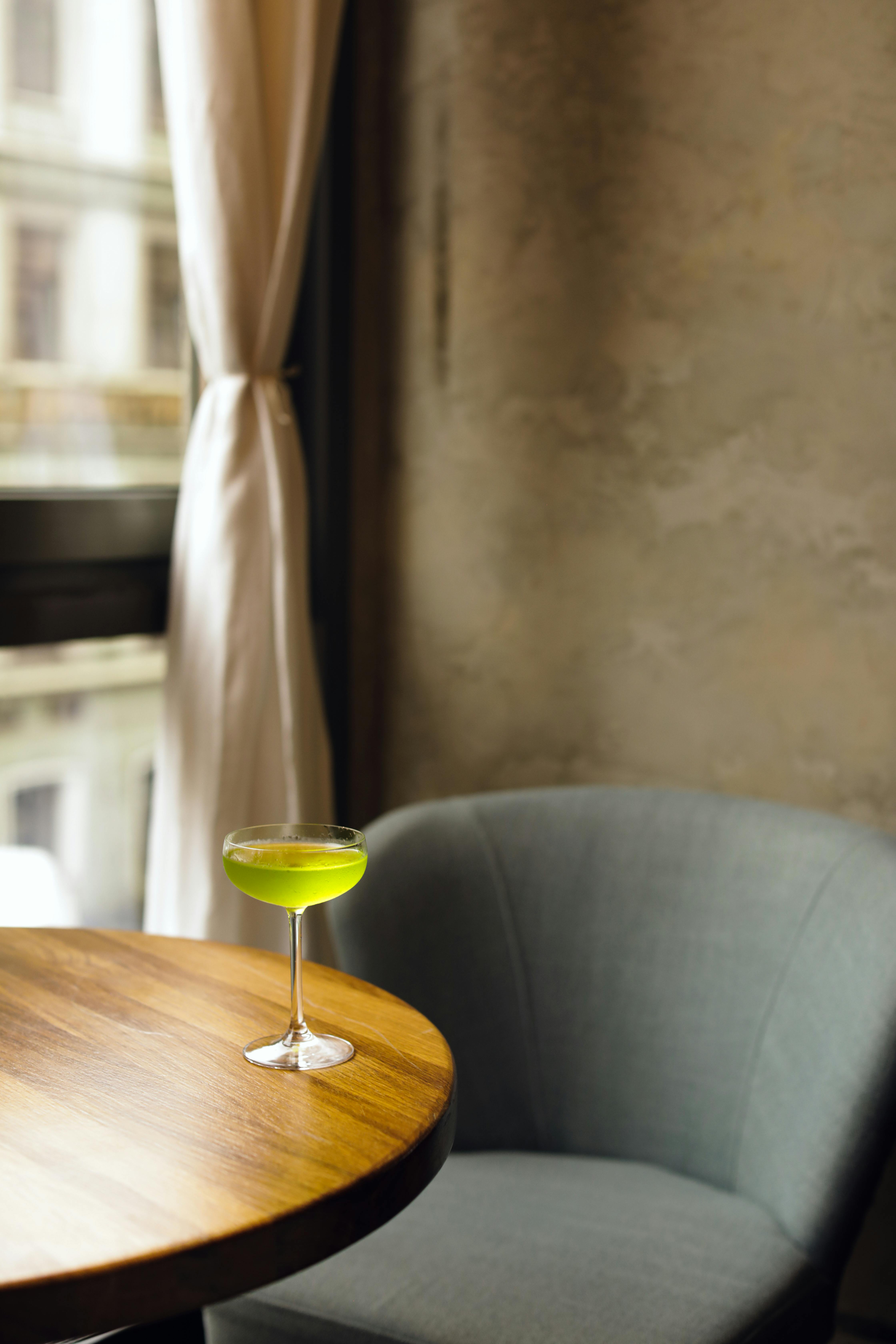 A Glass of Cocktail on a Wooden Table · Free Stock Photo