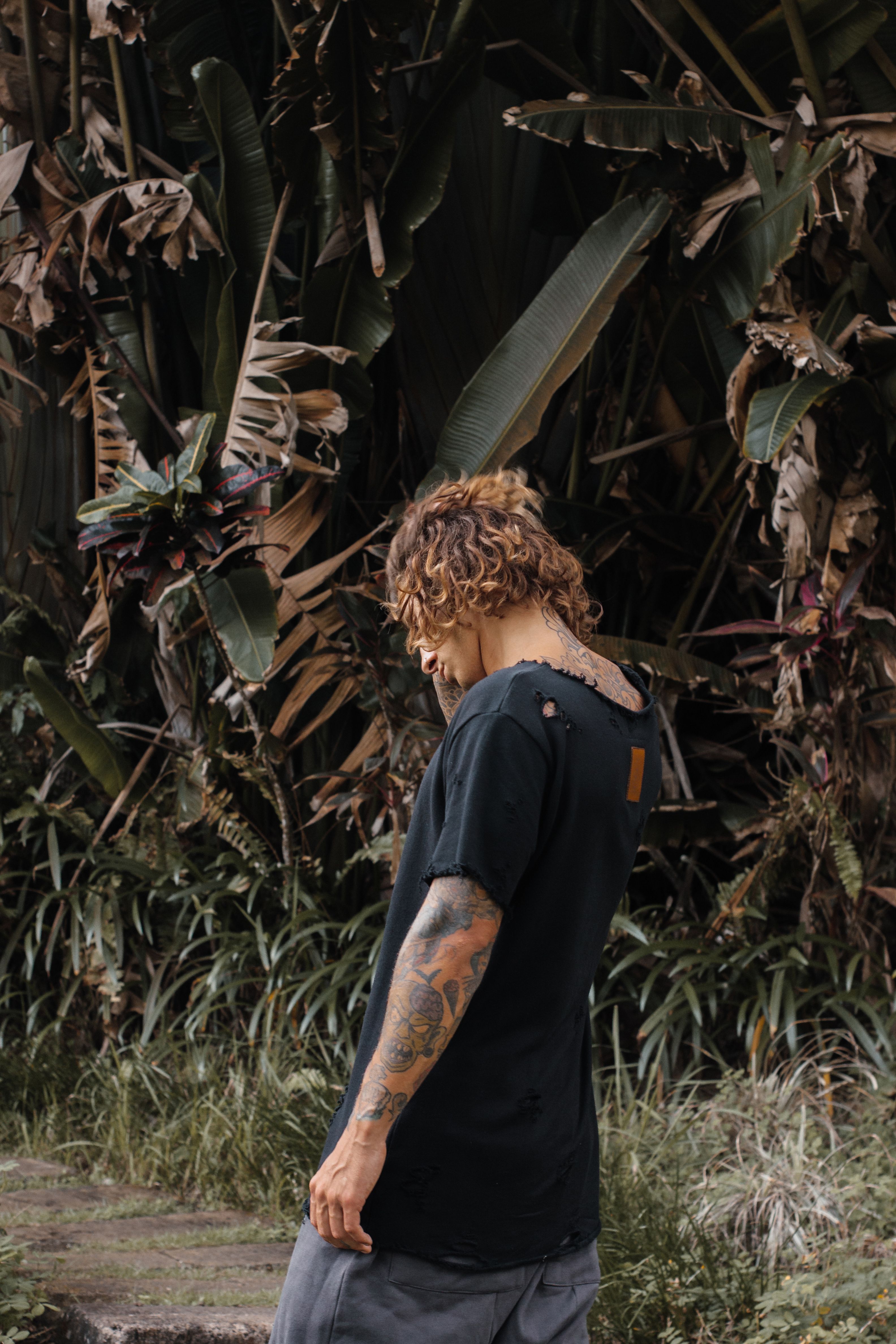 Close-Up Shot of a Blond Man With Tattoos · Free Stock Photo