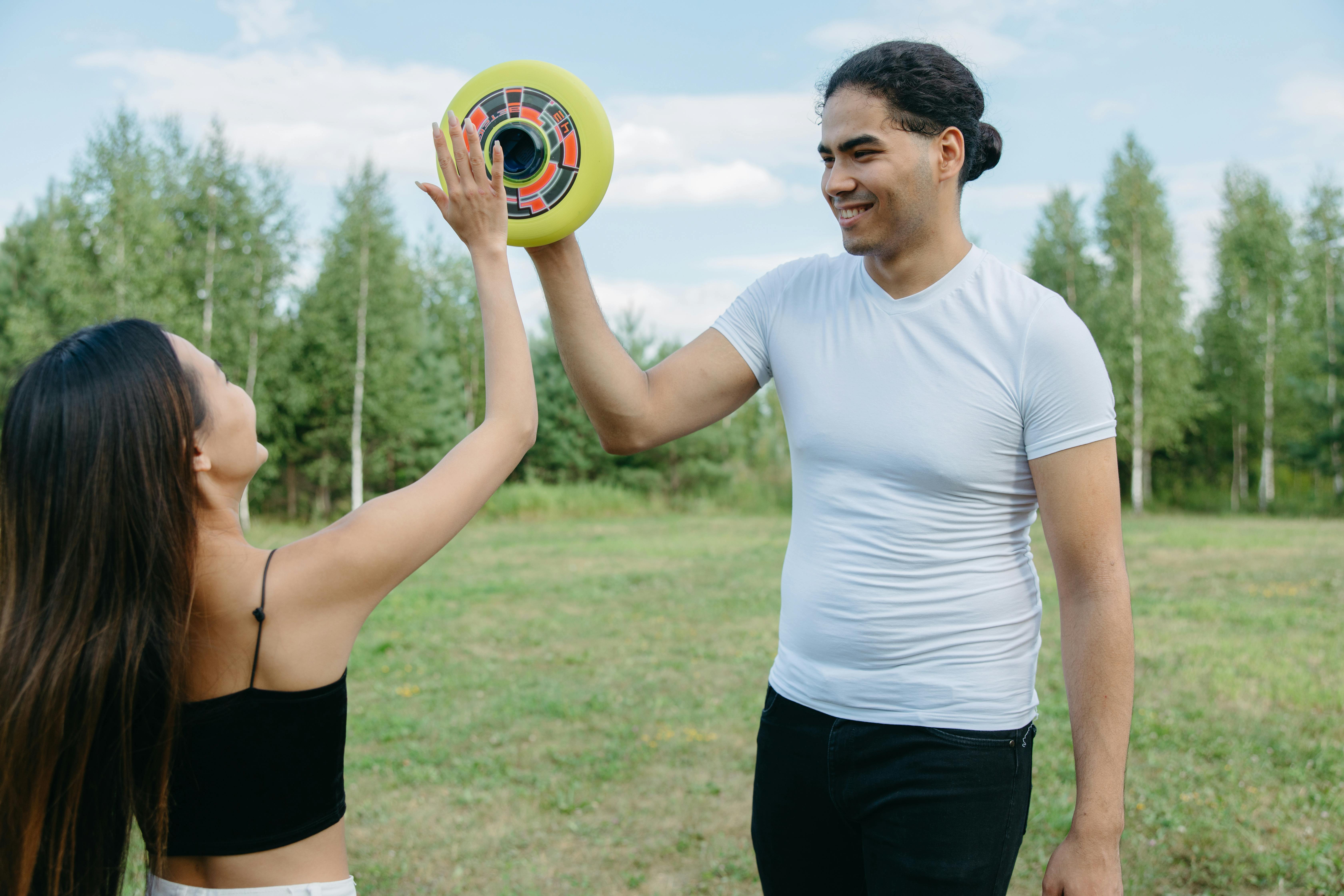 A Man Holding Yellow Frisbee · Free Stock Photo
