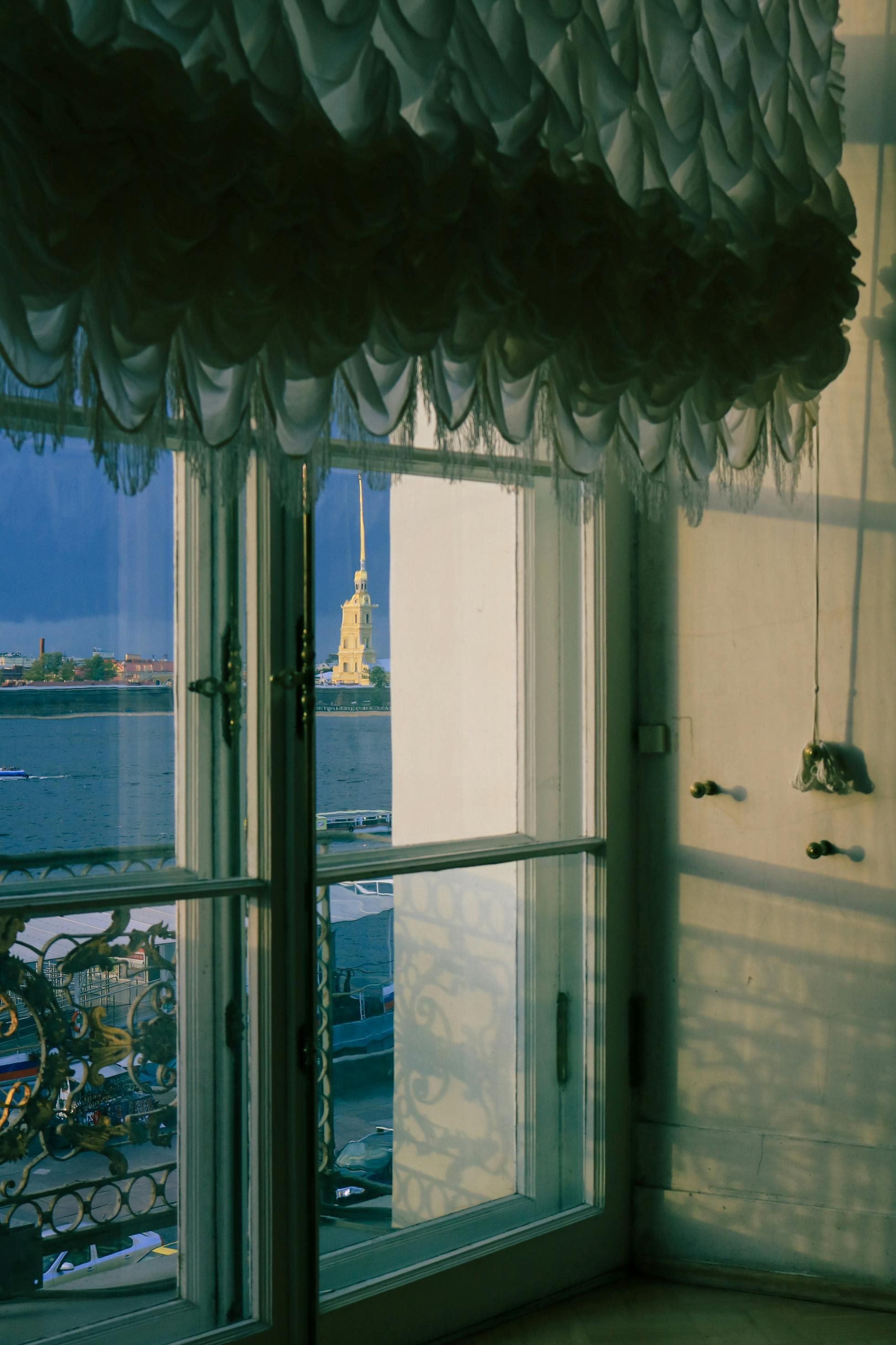 View from a House Window onto a Promenade Water · Free Stock Photo