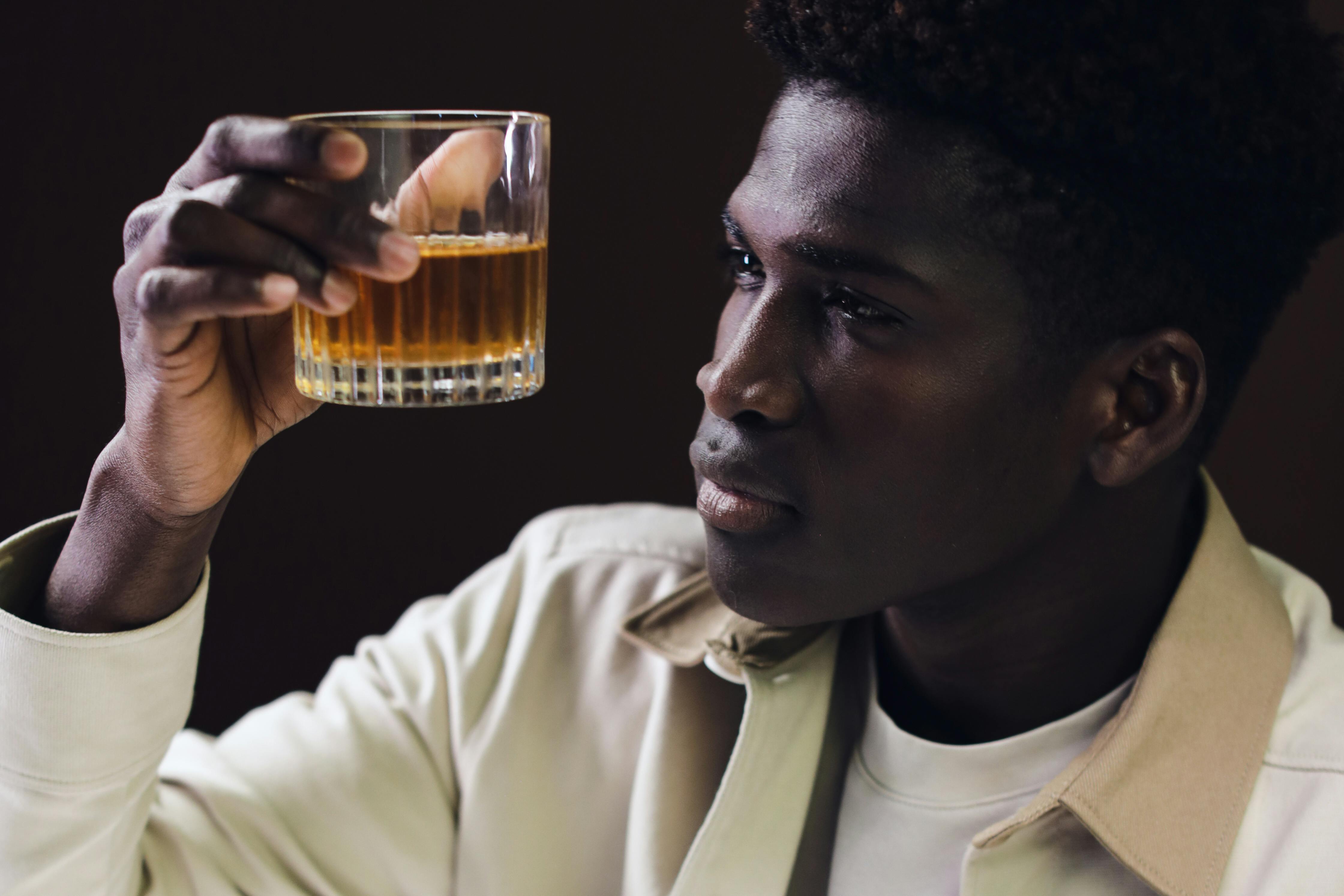 A Man Drinking Liquor in a Glass · Free Stock Photo