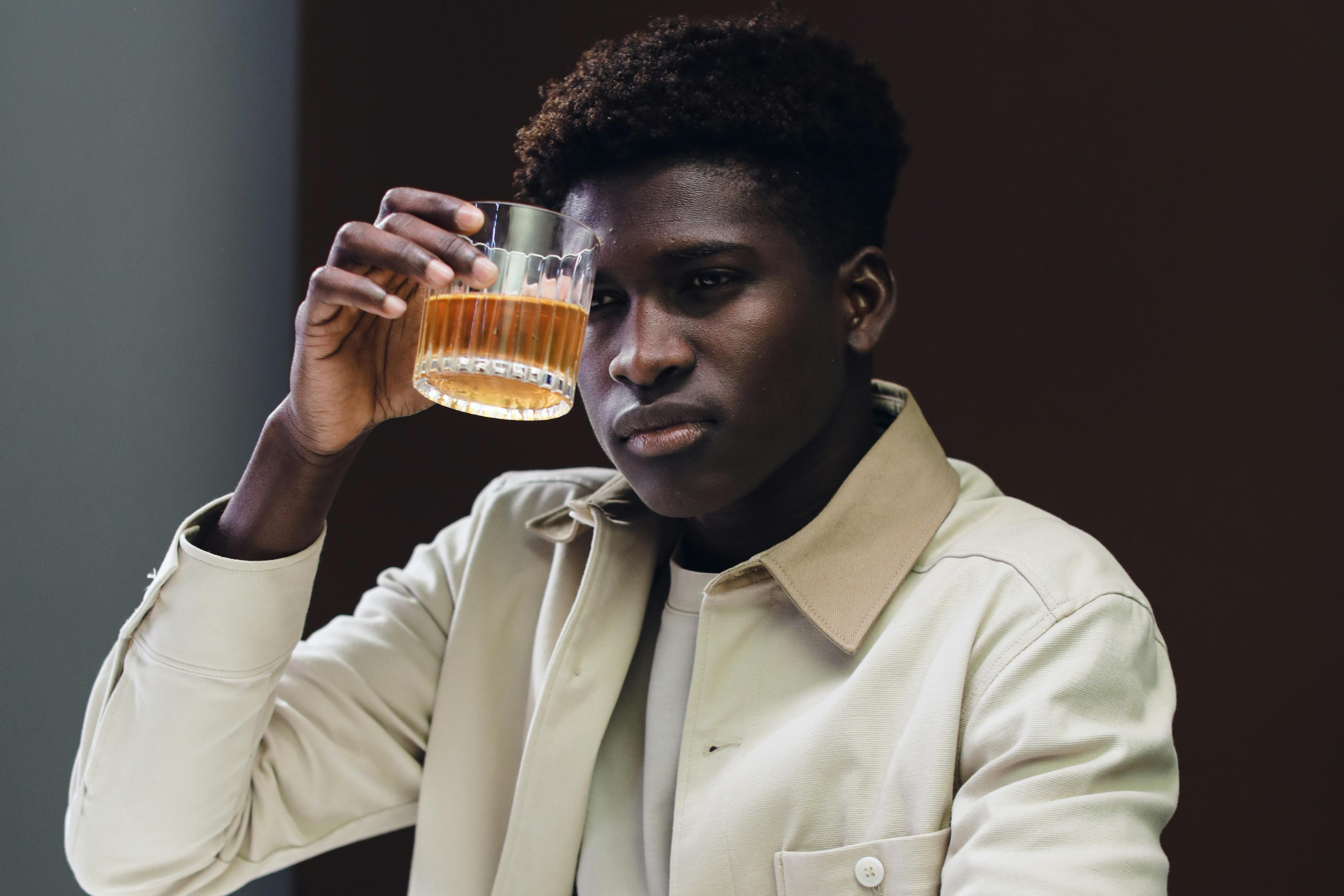 Man Holding his Drink · Free Stock Photo