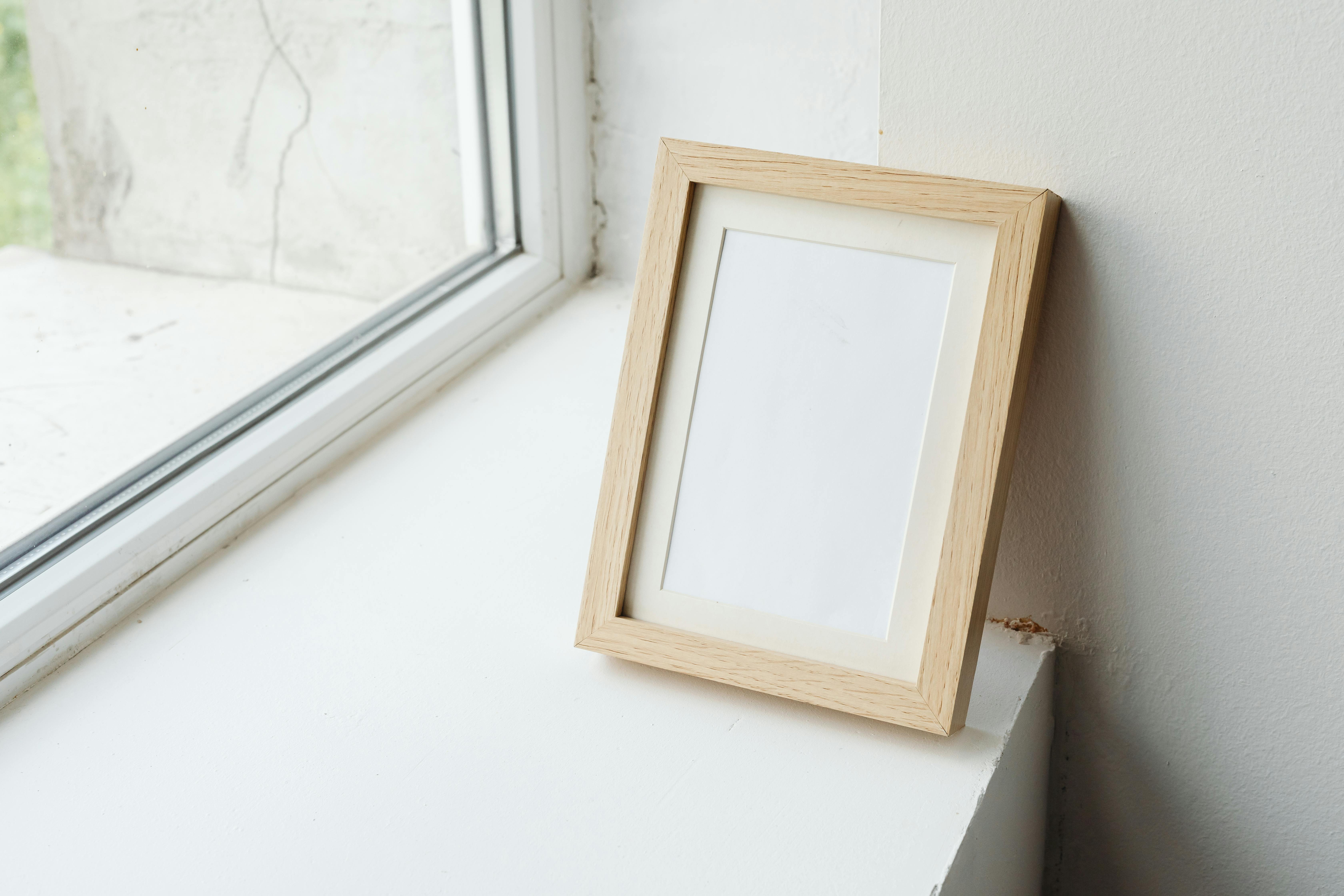 An Empty Picture Frame on a Window Sill · Free Stock Photo