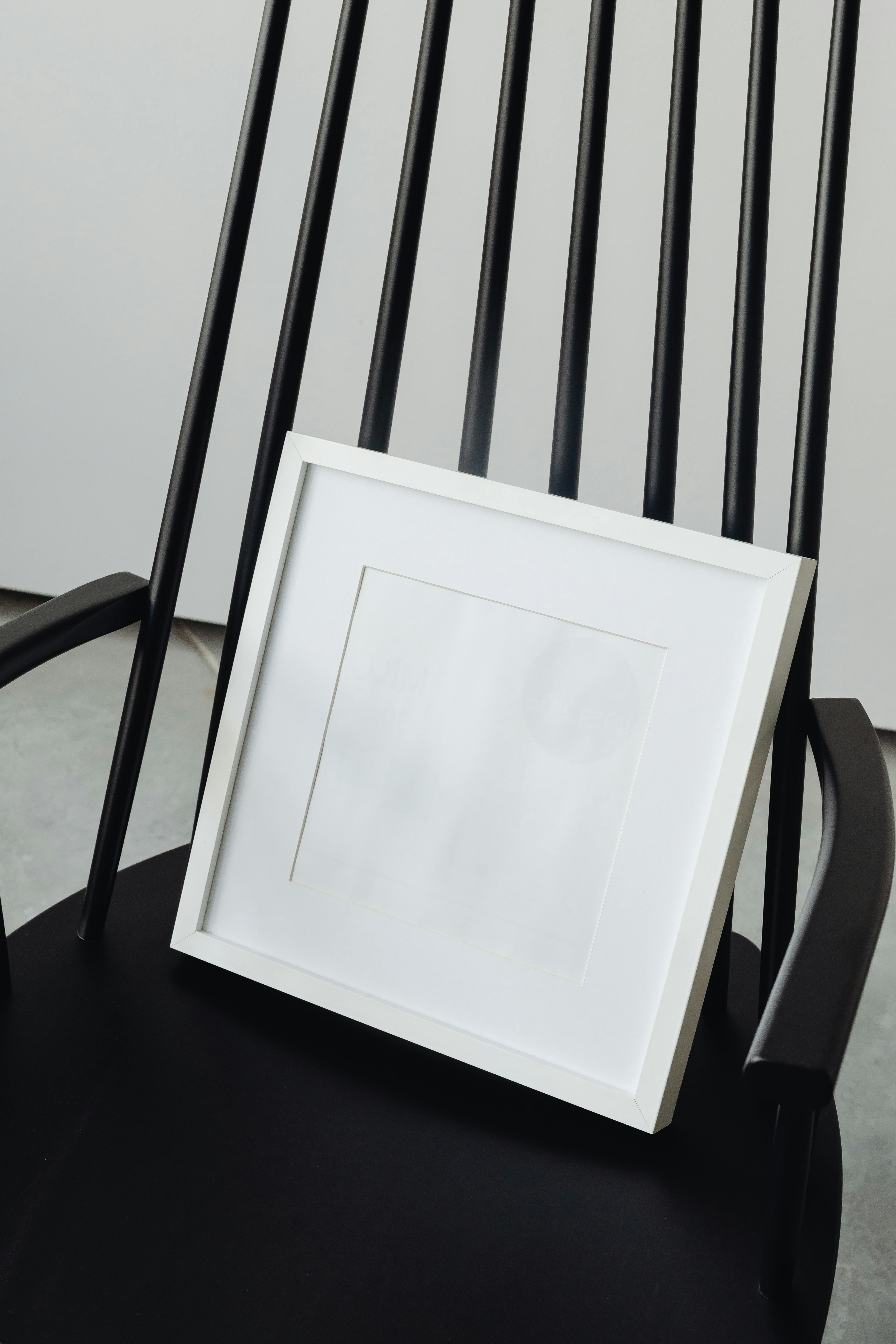 White Picture Frame on the Chair · Free Stock Photo
