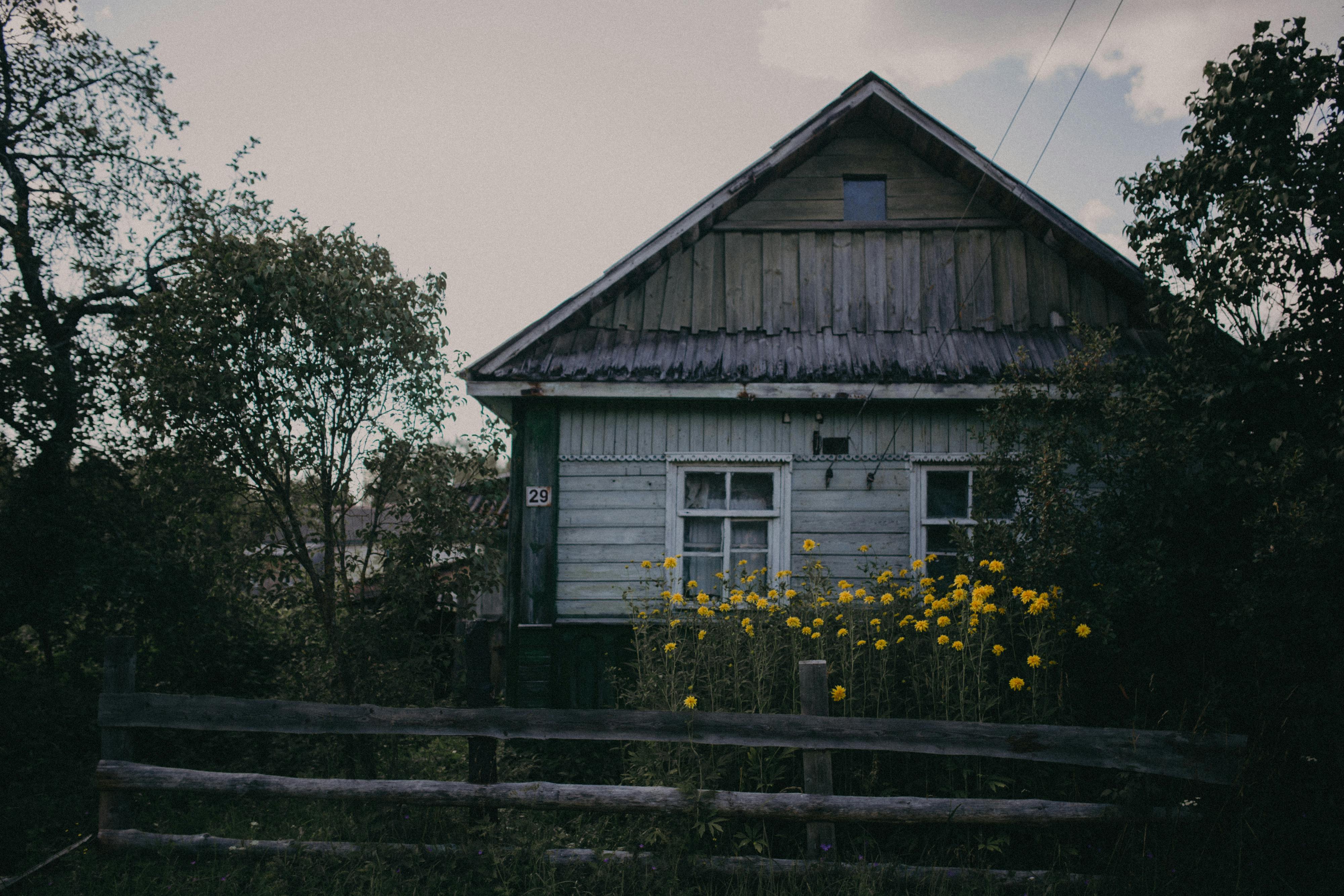 Photograph of a Wooden Shabby House · Free Stock Photo