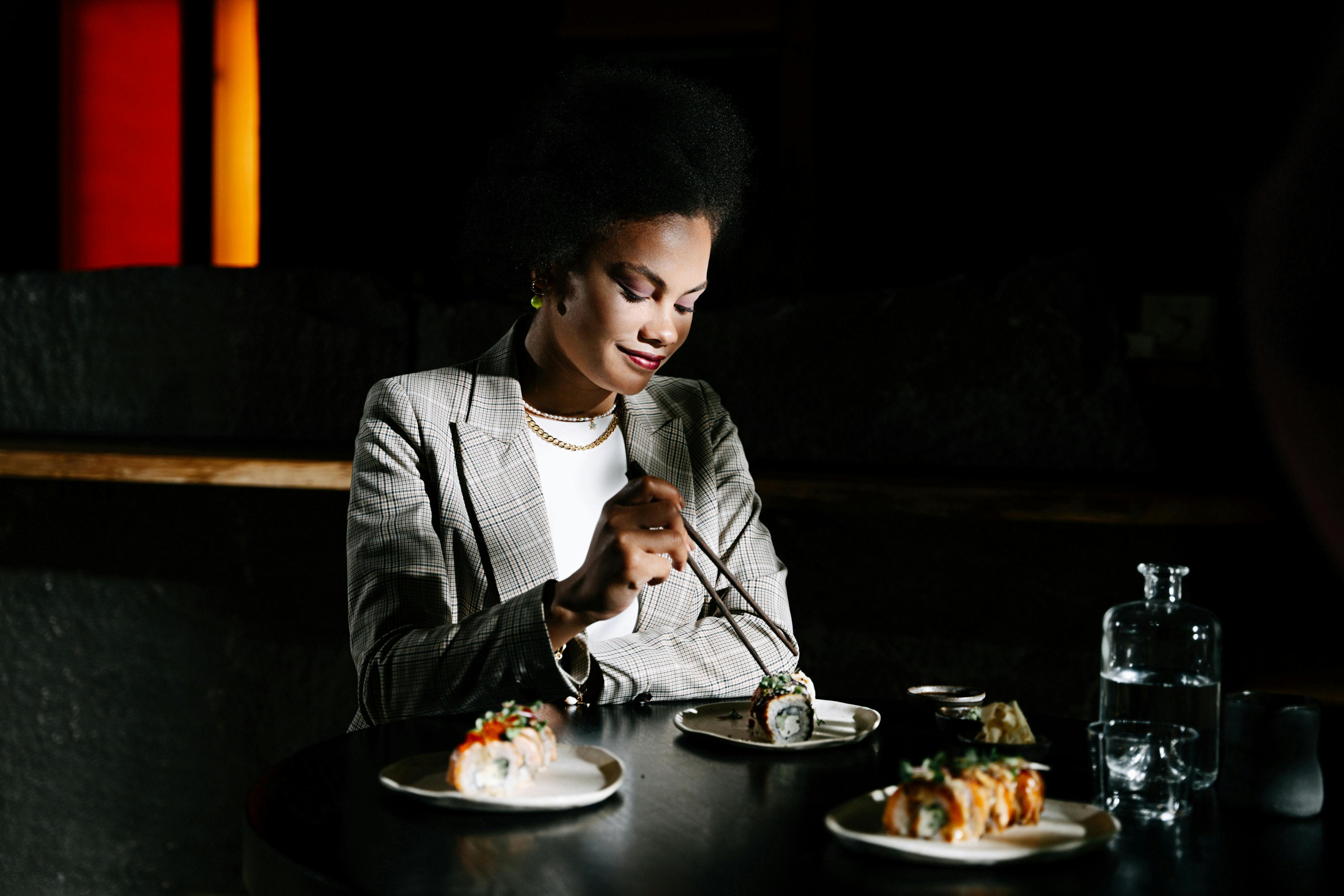 Woman Using Chopsticks to Eat · Free Stock Photo
