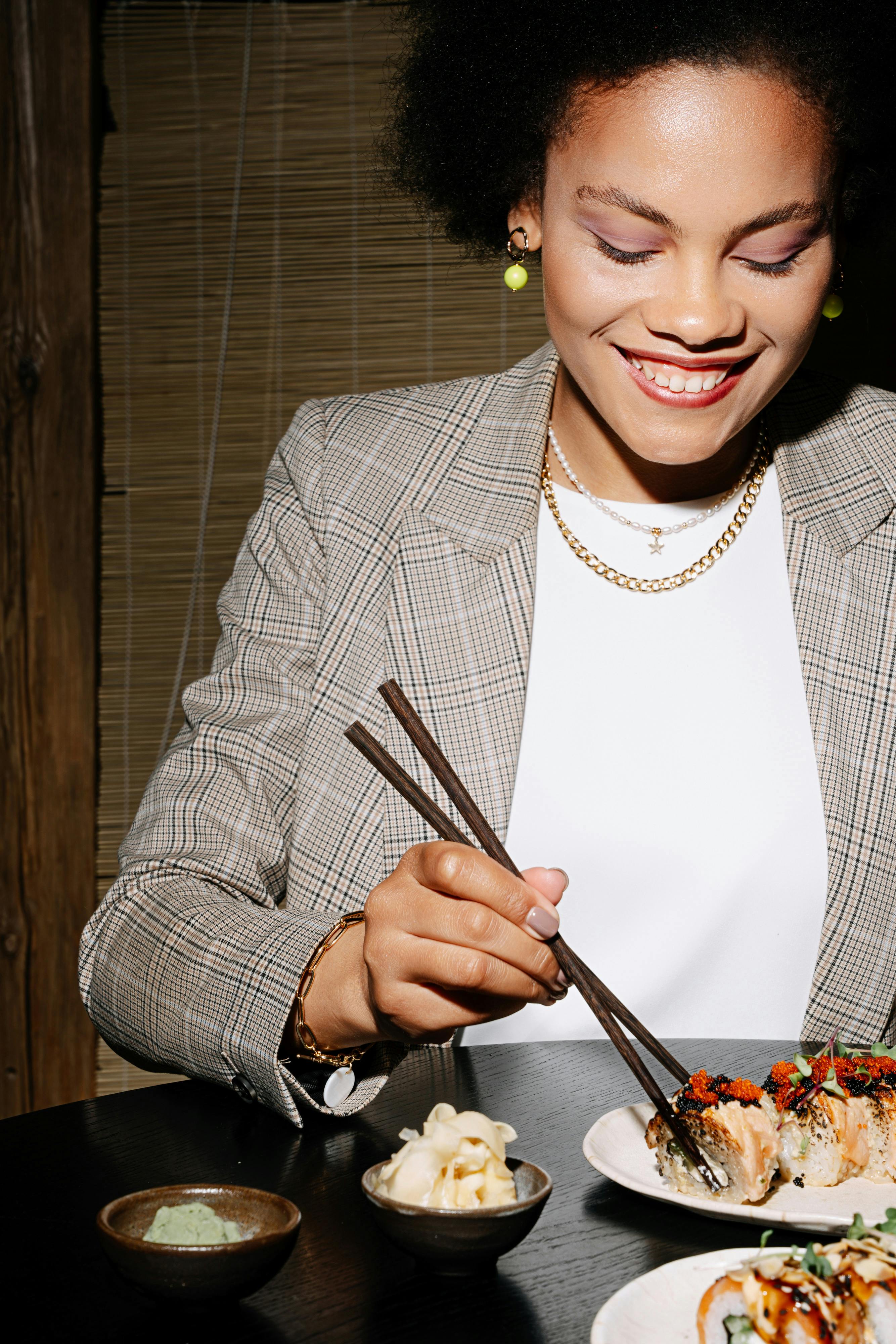 Smiling Woman Holding Chopsticks · Free Stock Photo