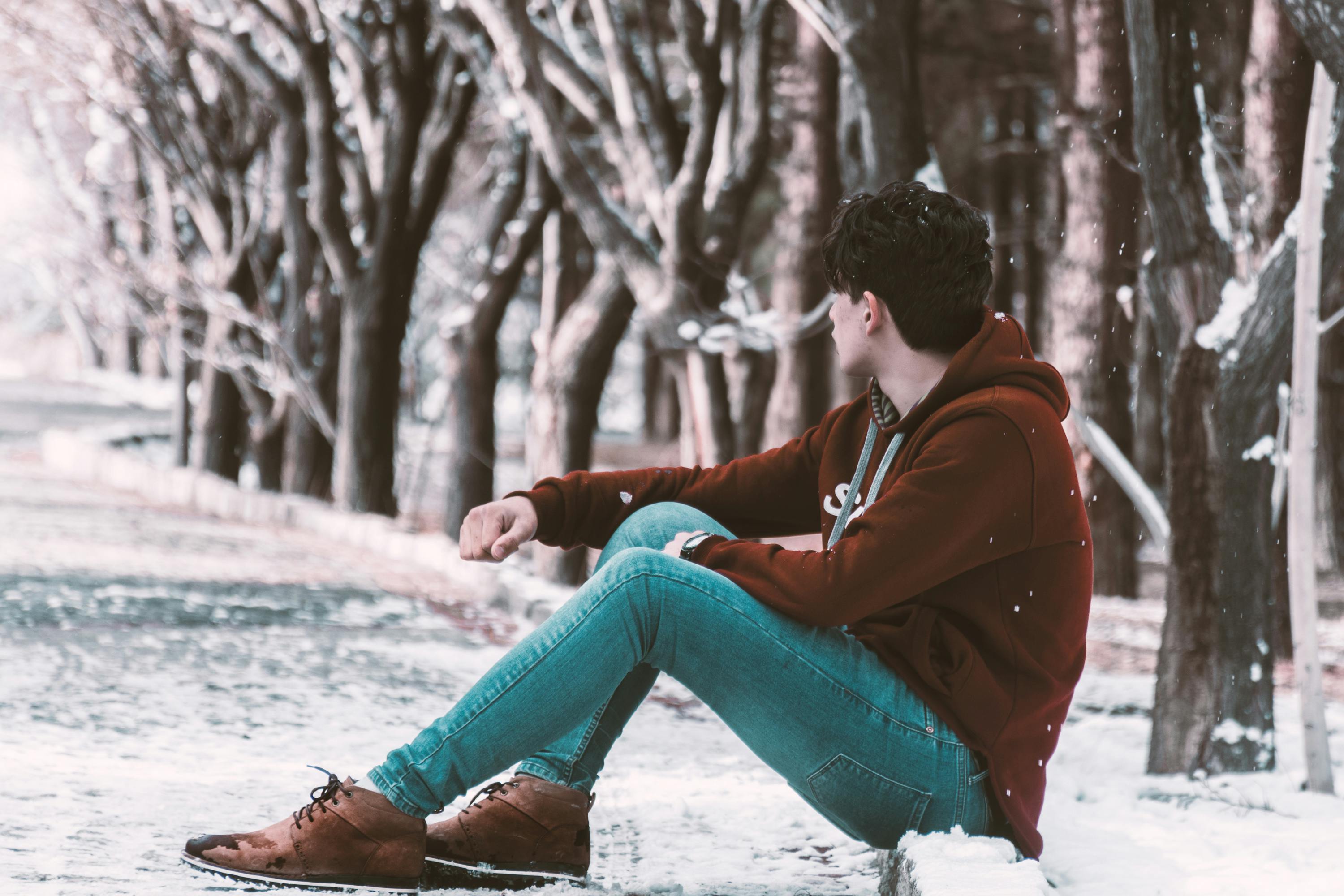 Man Sitting on Ground With Snow · Free Stock Photo