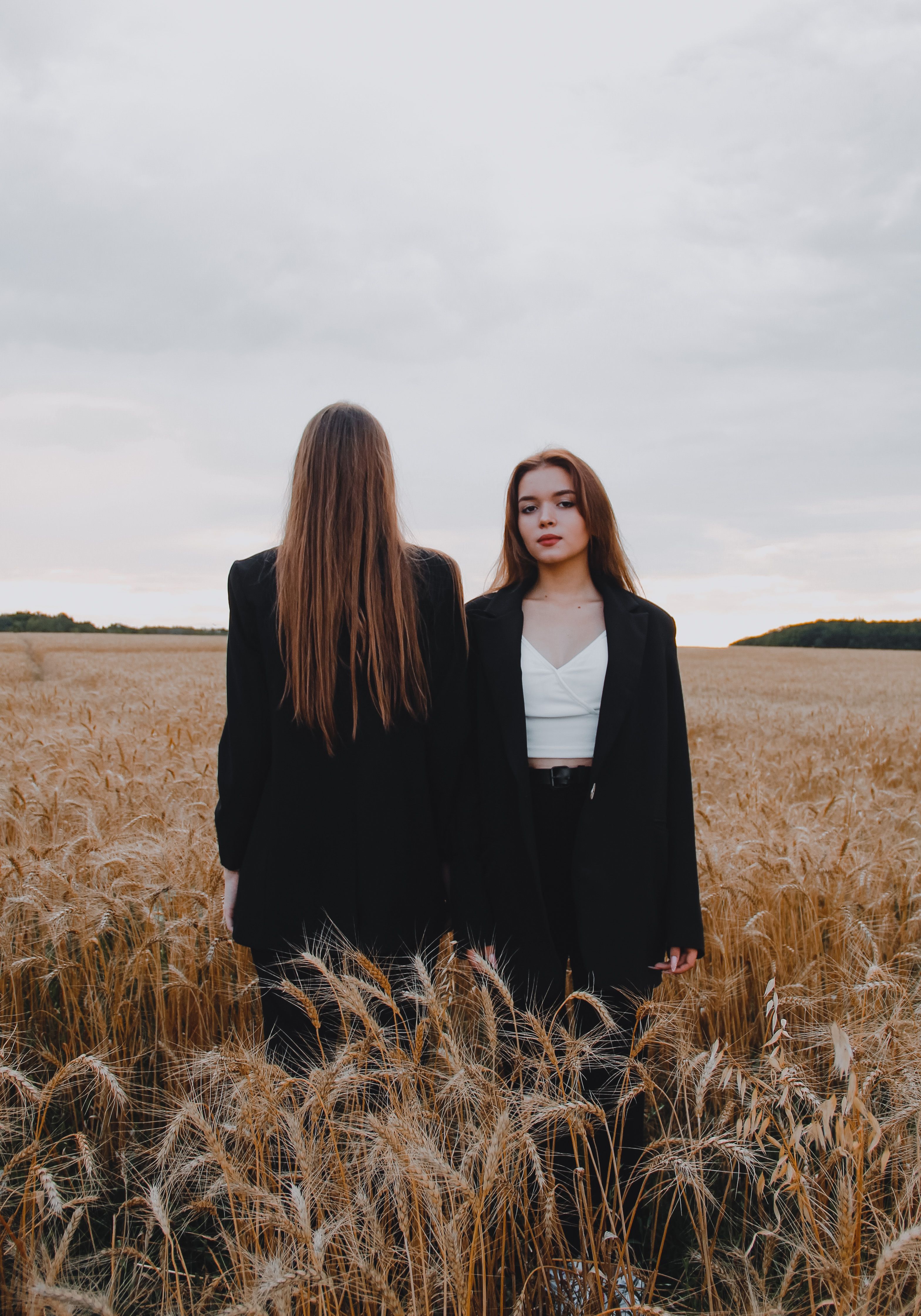 Women Standing on Grass Field · Free Stock Photo